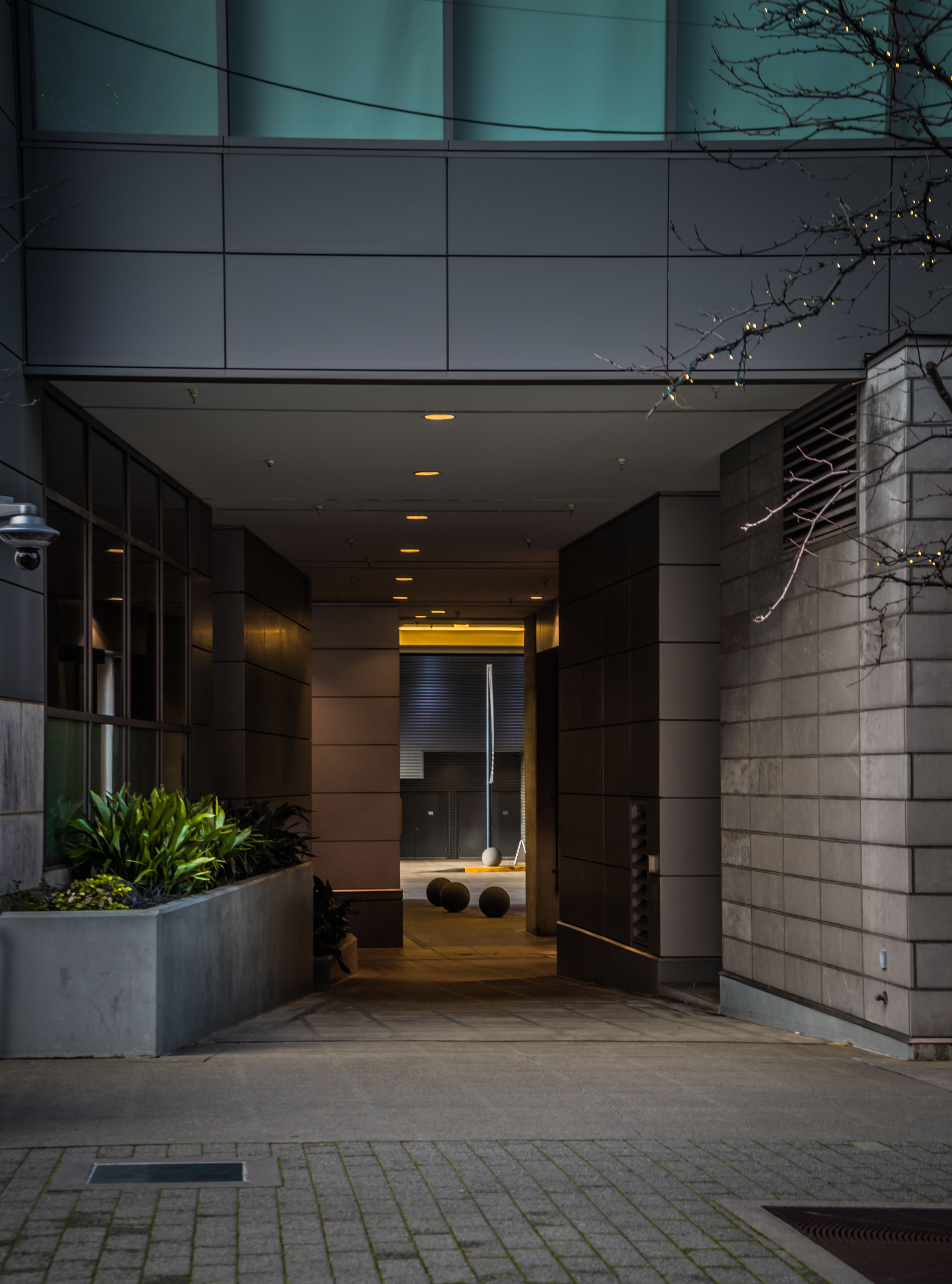 A building entrance with a lighted sign · Free Stock Photo