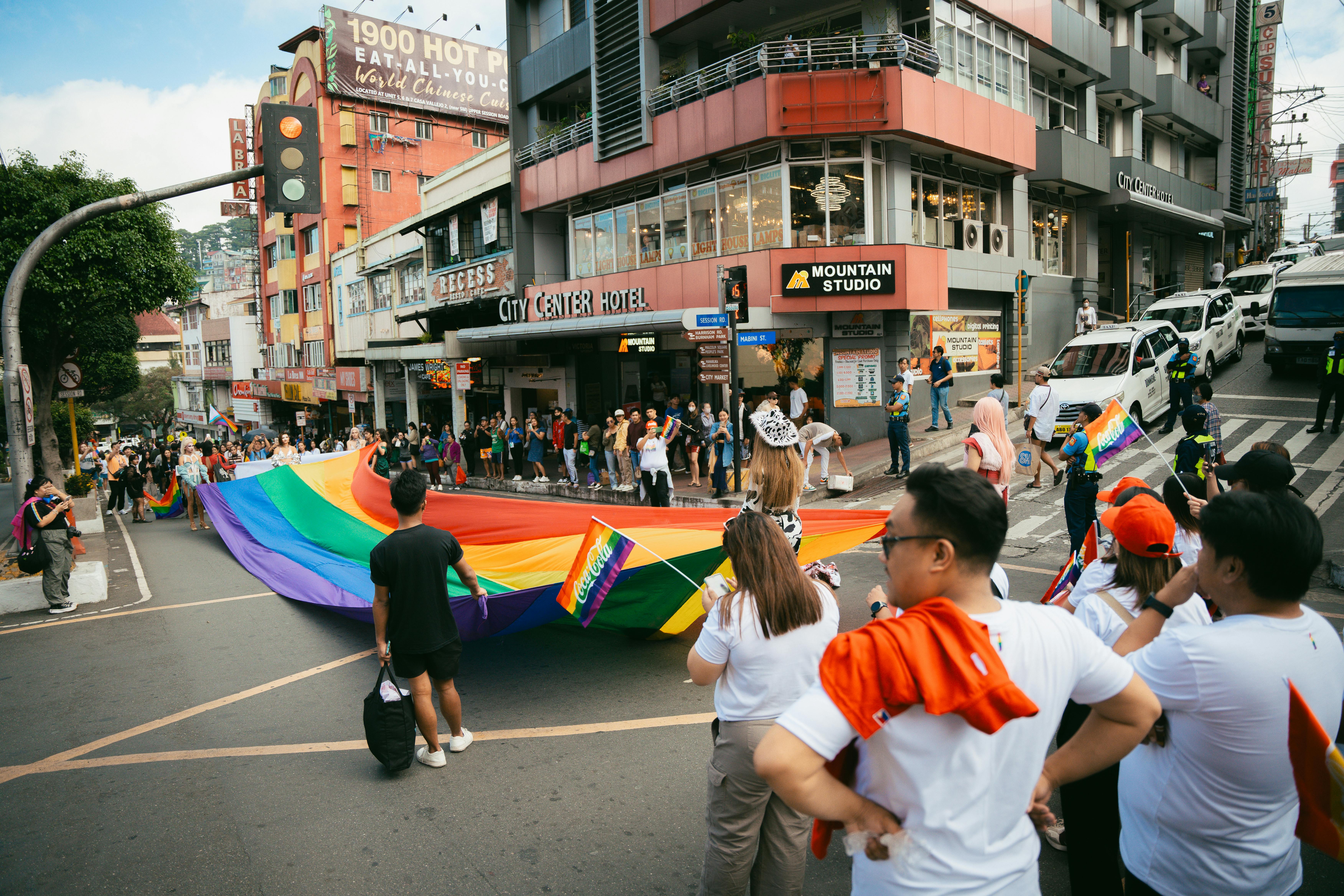 Crowd with Flag in Parade on Street · Free Stock Photo