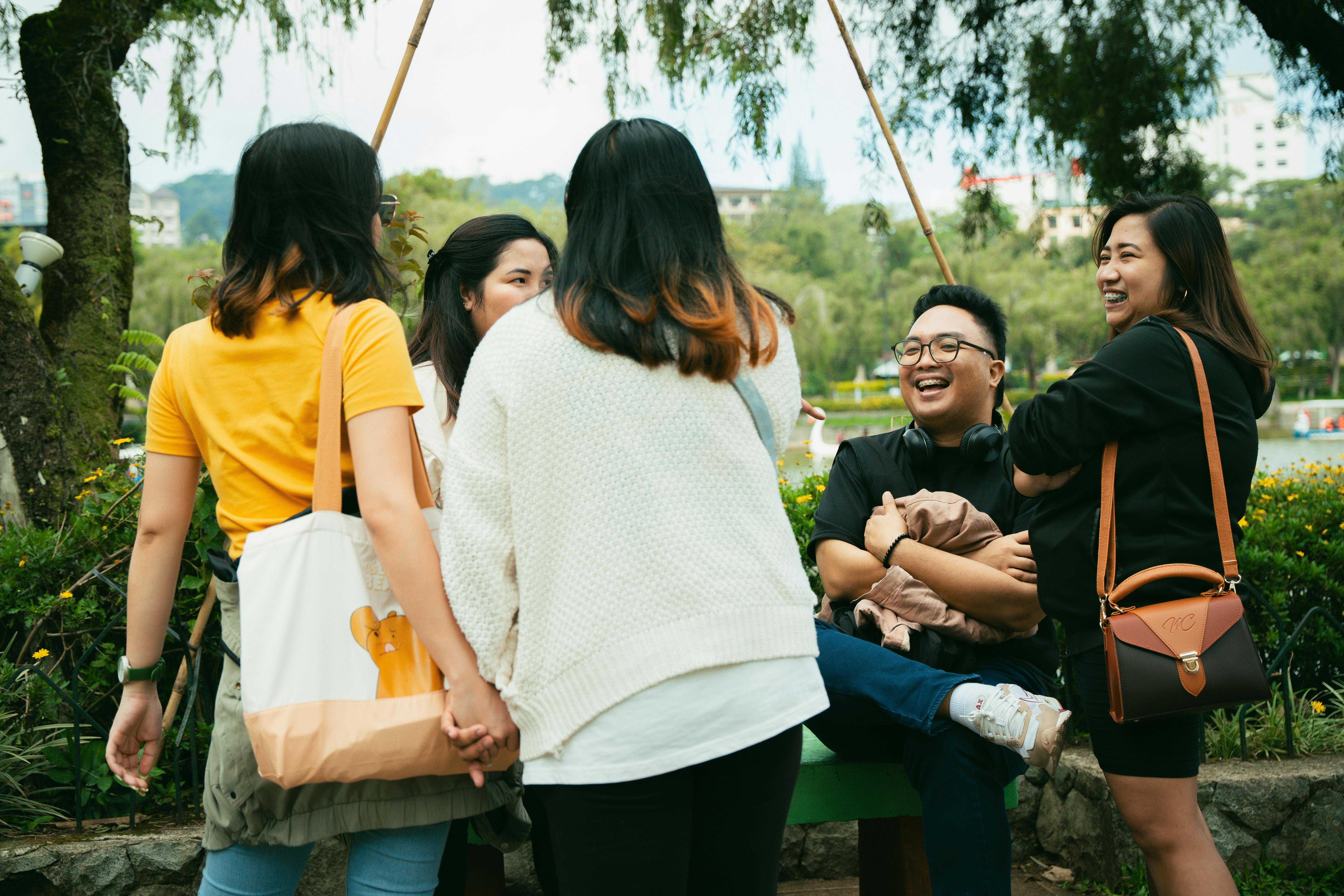 Smiling Friends Talking at Park · Free Stock Photo