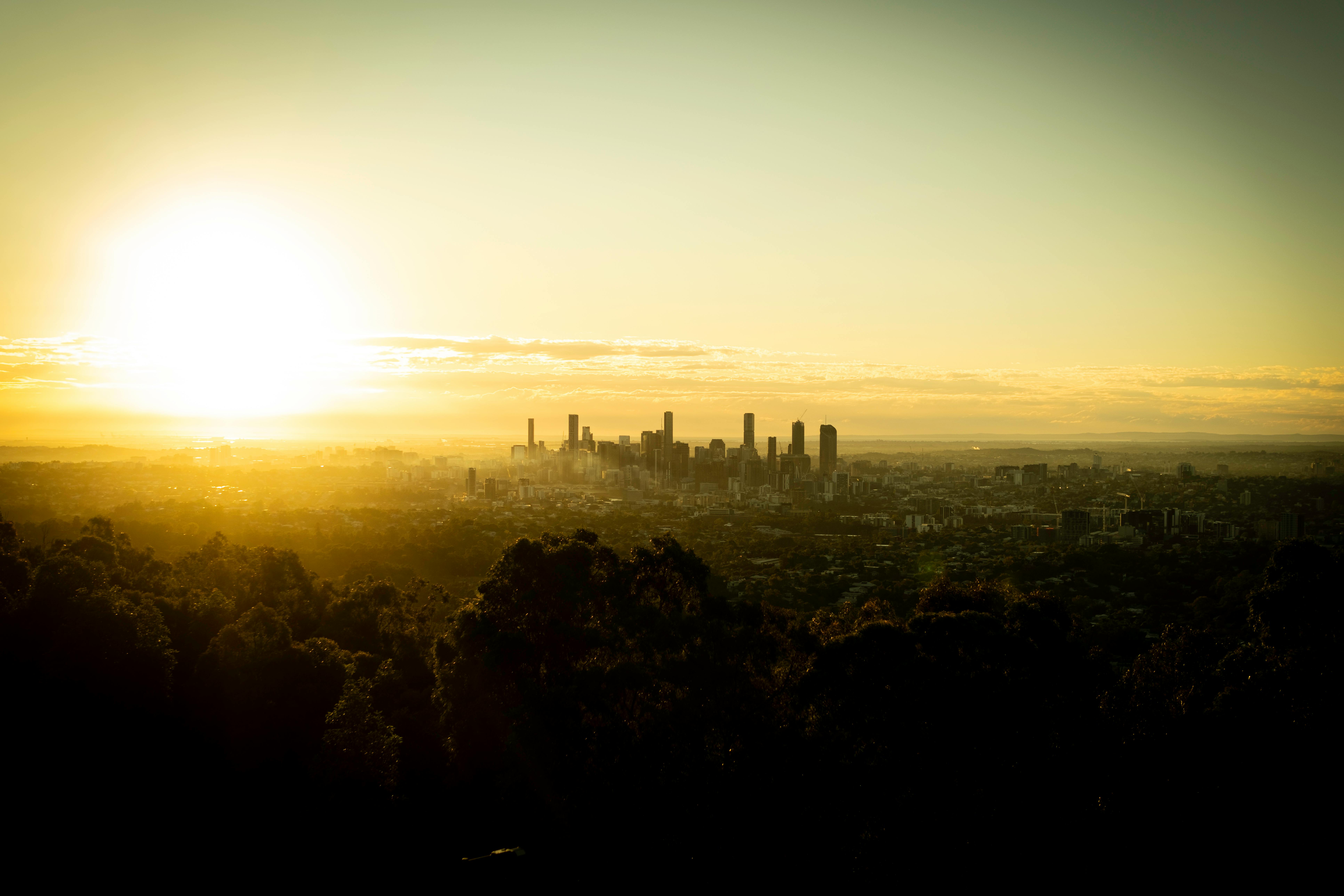 Sun over City Skyscrapers at Sunset · Free Stock Photo
