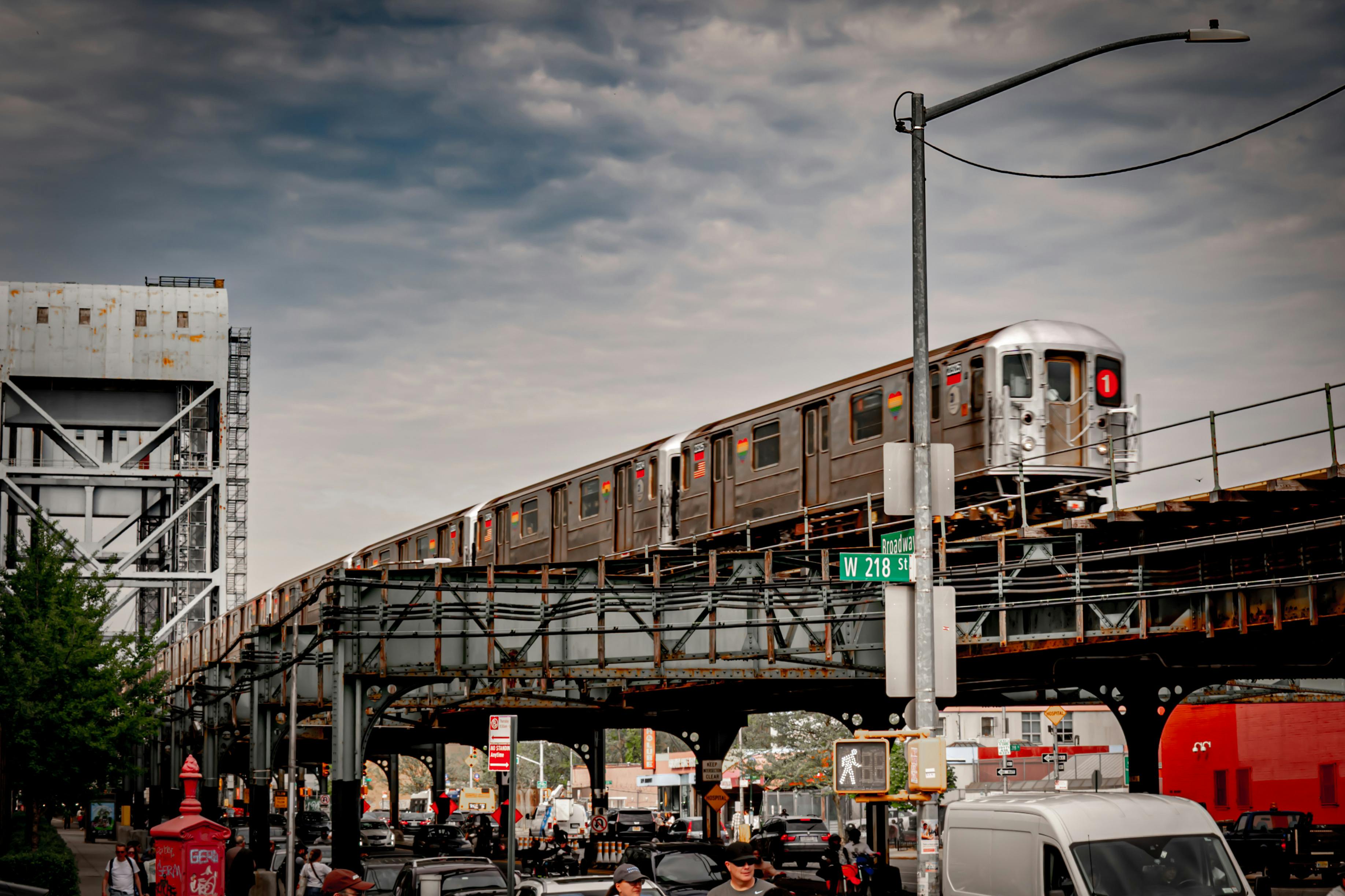 View of a Busy Street and the Subway Train on Elevated Railway in New ...