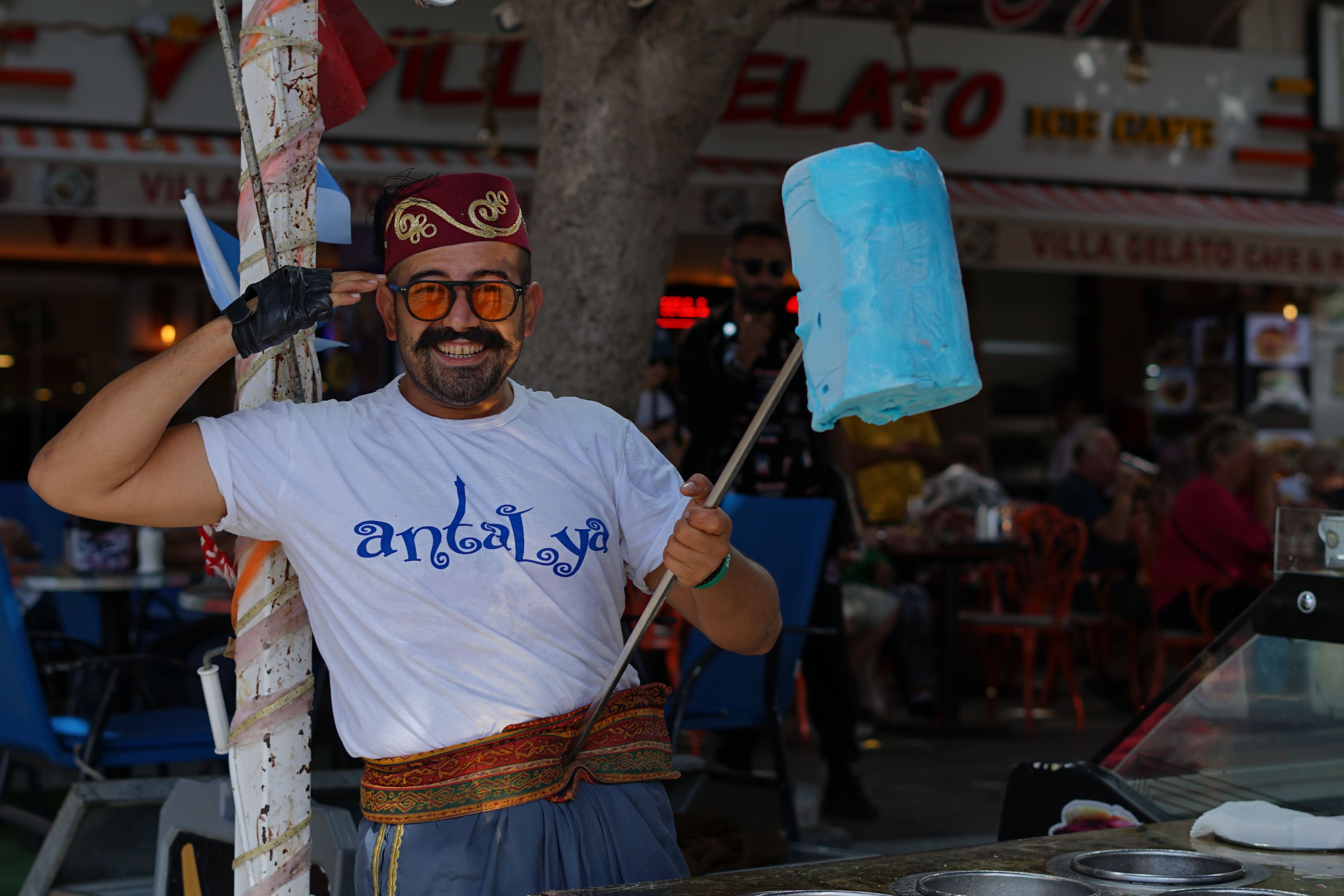 A Smiling Man with Mustache Selling Traditional Turkish Ice Cream ...