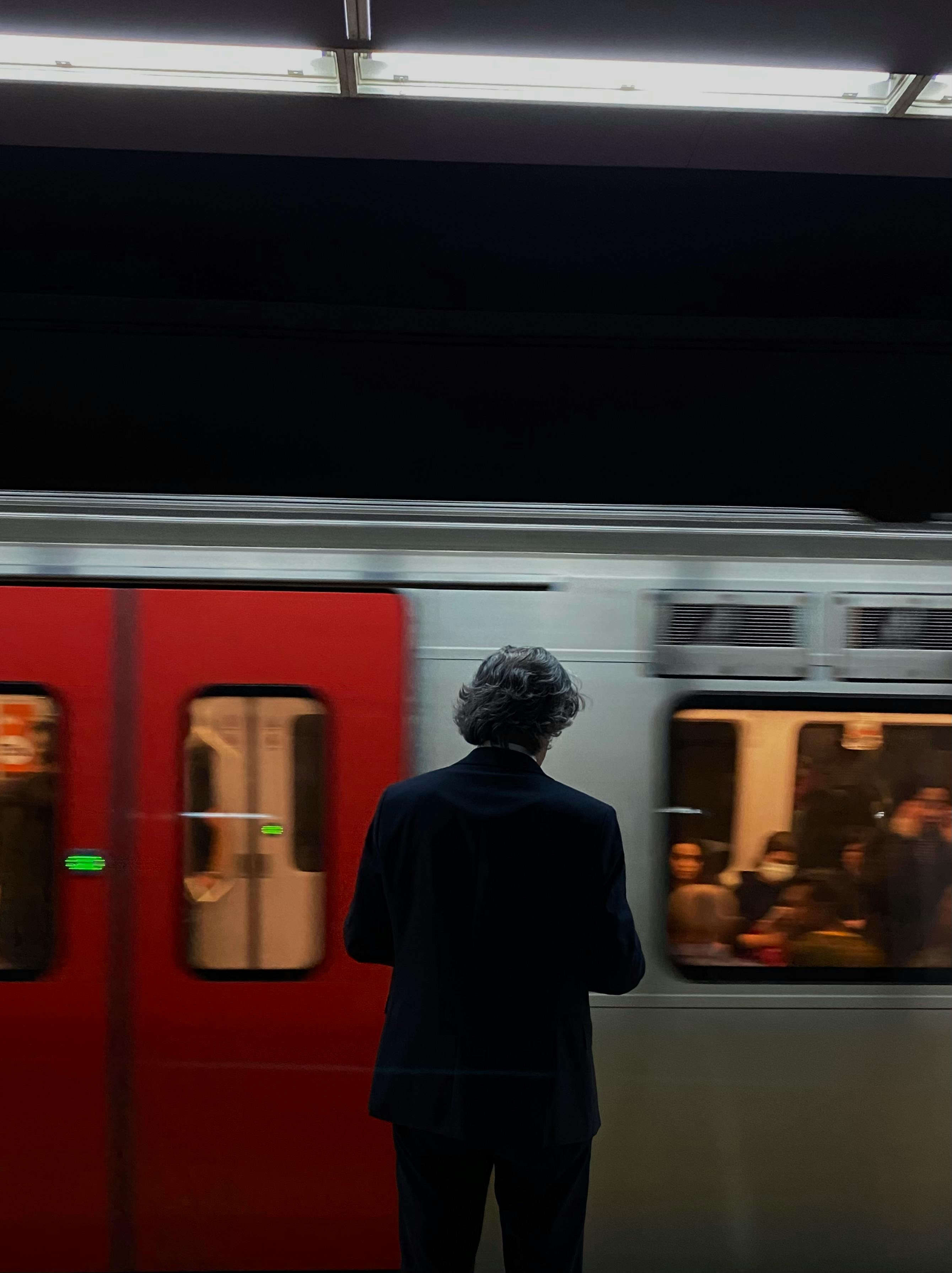 Grayscale Photo of People Inside Train · Free Stock Photo