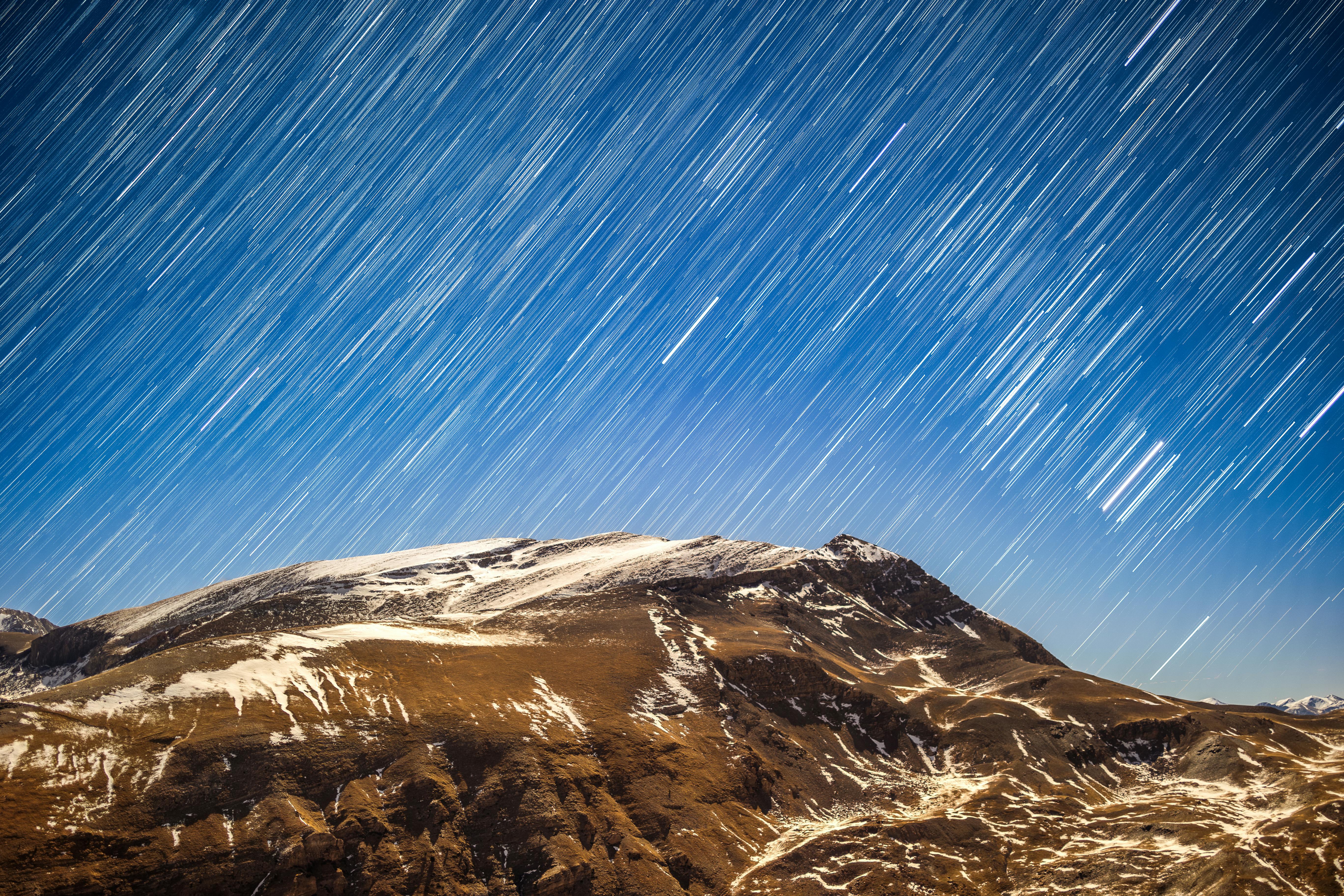 Stars Streaks over Snow Covered Mountain · Free Stock Photo