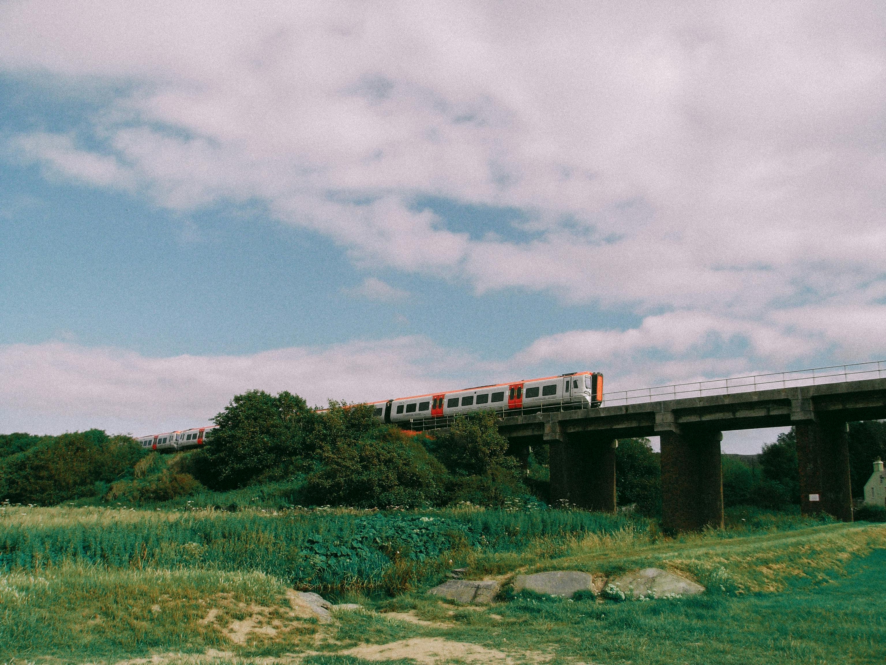 CAF Civity Class 197 Passenger Train Entering the Bridge · Free Stock Photo