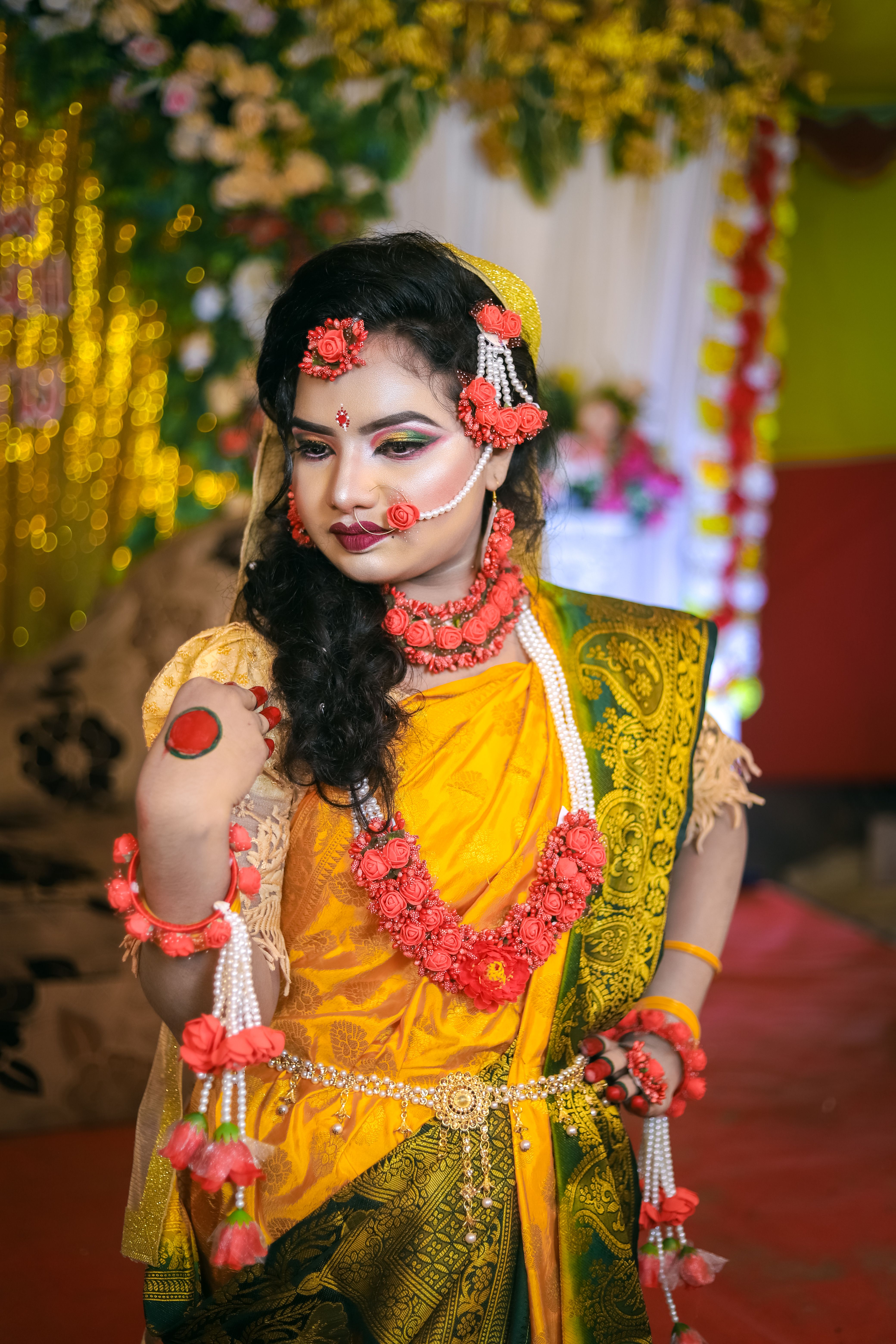 A woman in traditional indian attire posing for the camera · Free Stock ...