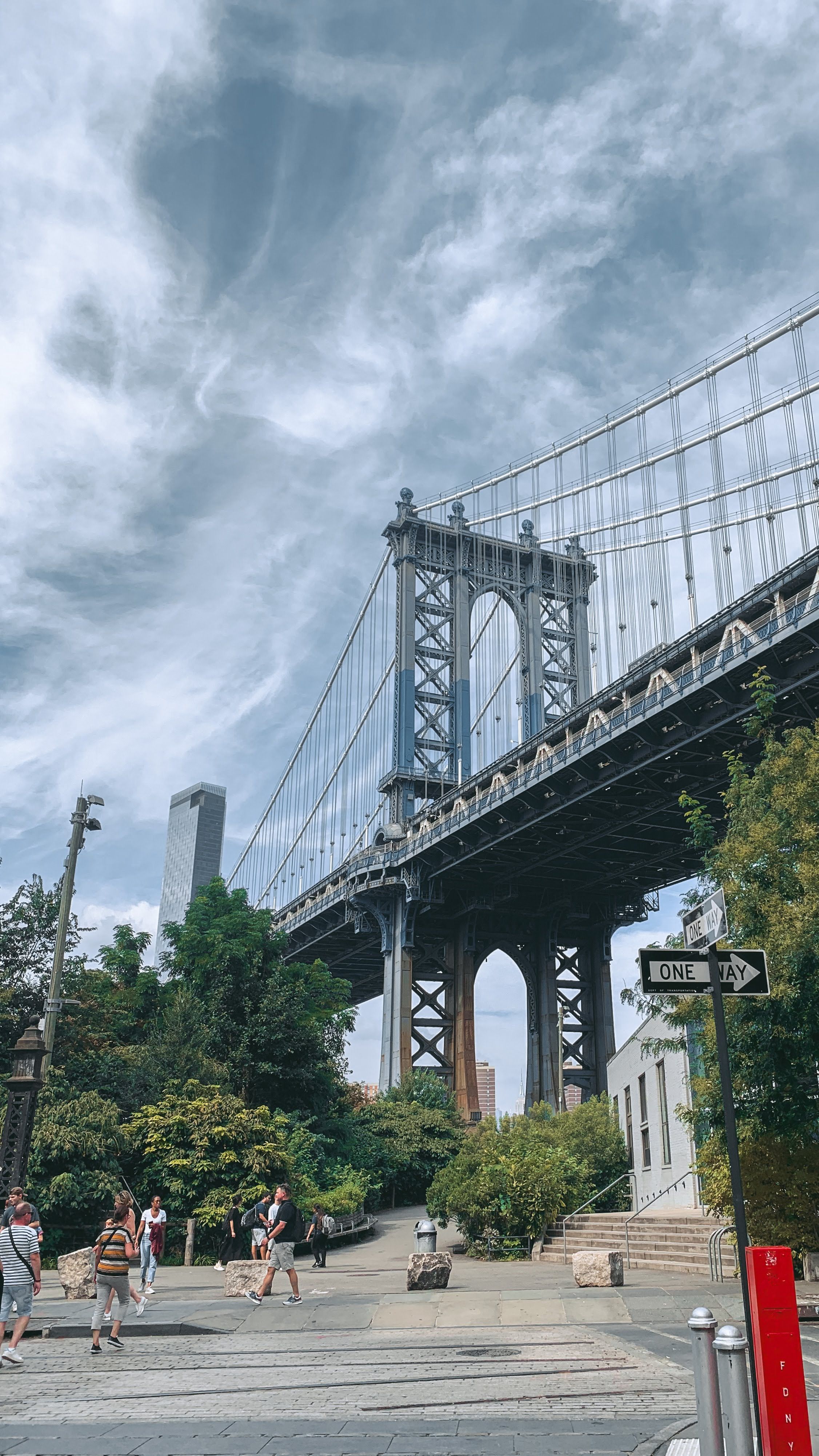 Manhattan Bridge with People Walking in the Foreground · Free Stock Photo