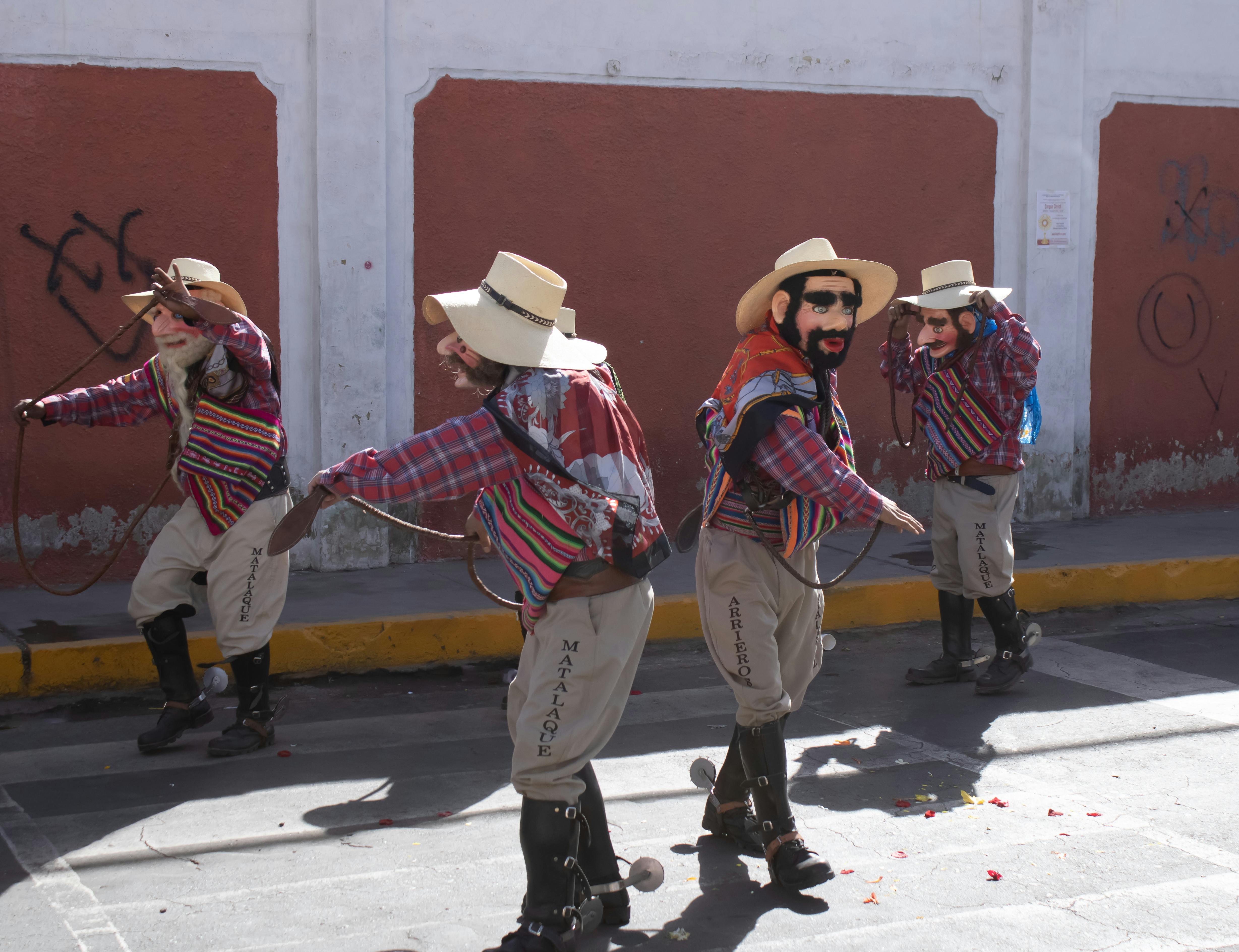 People Wearing Ponchos, Cowboy Hats and Masks of Bearded Men · Free ...