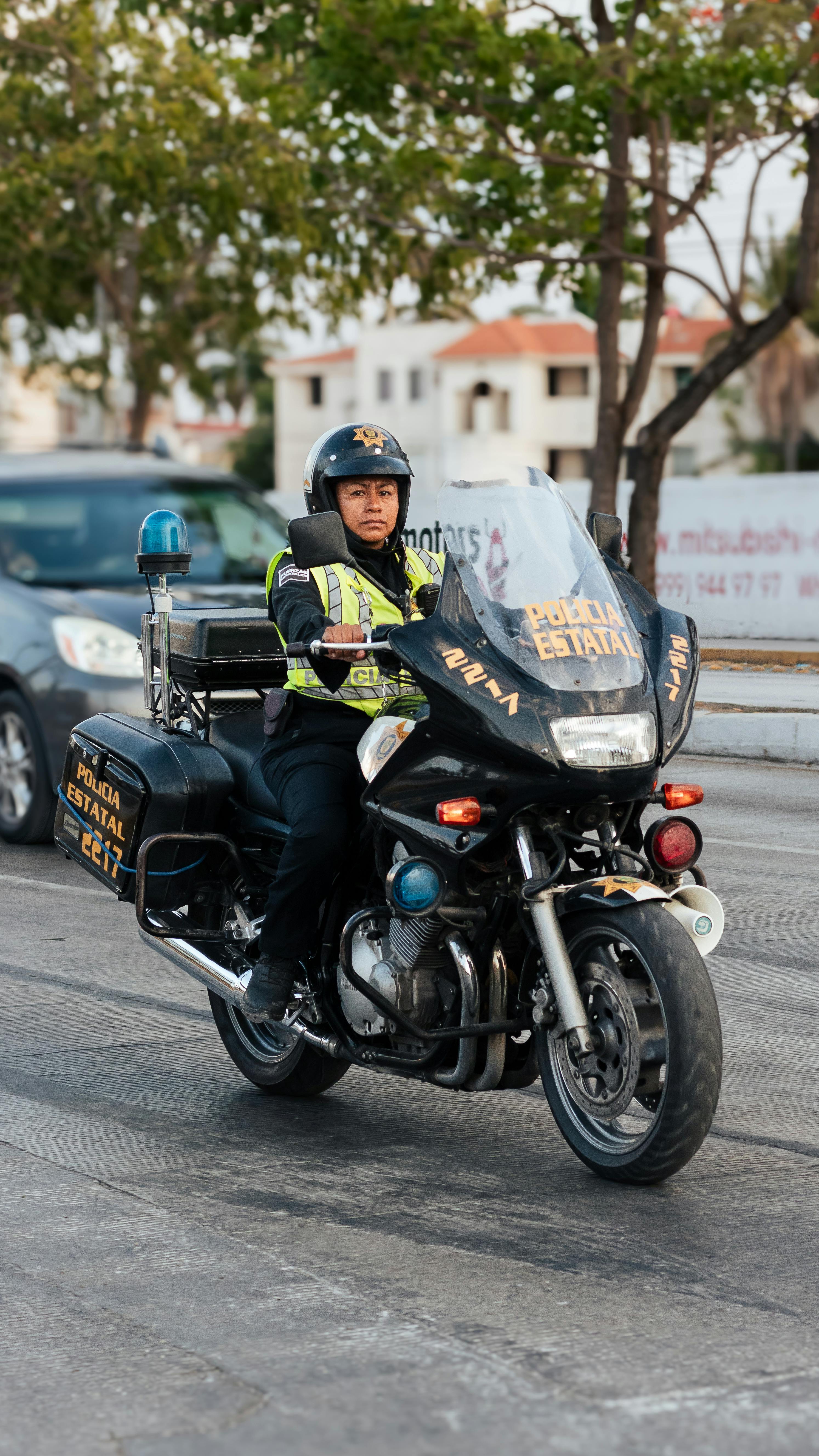 Policeman in a Uniform Standing by His Motorcycle · Free Stock Photo