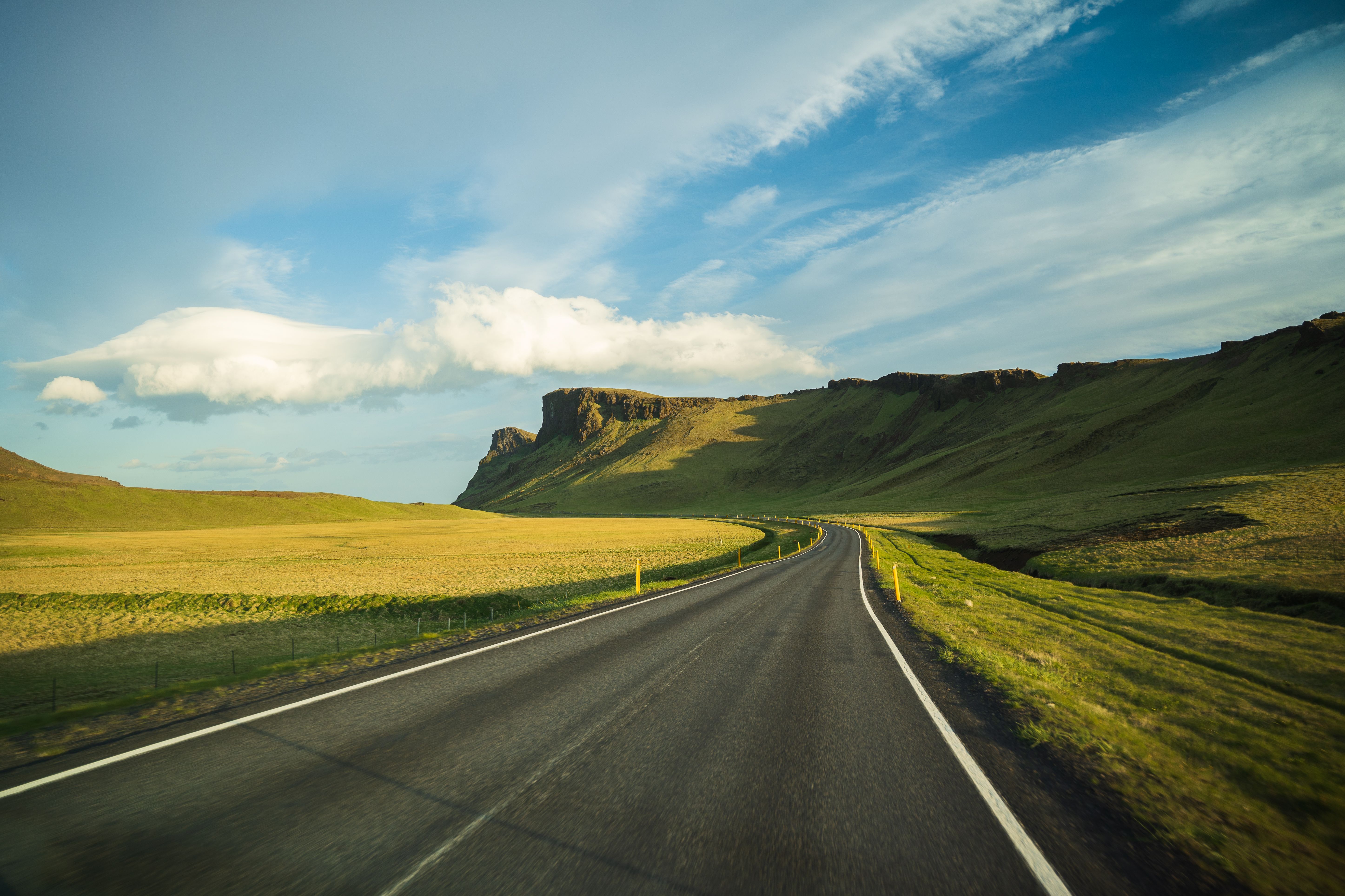Remote Asphalt Road with Hills in the Background · Free Stock Photo