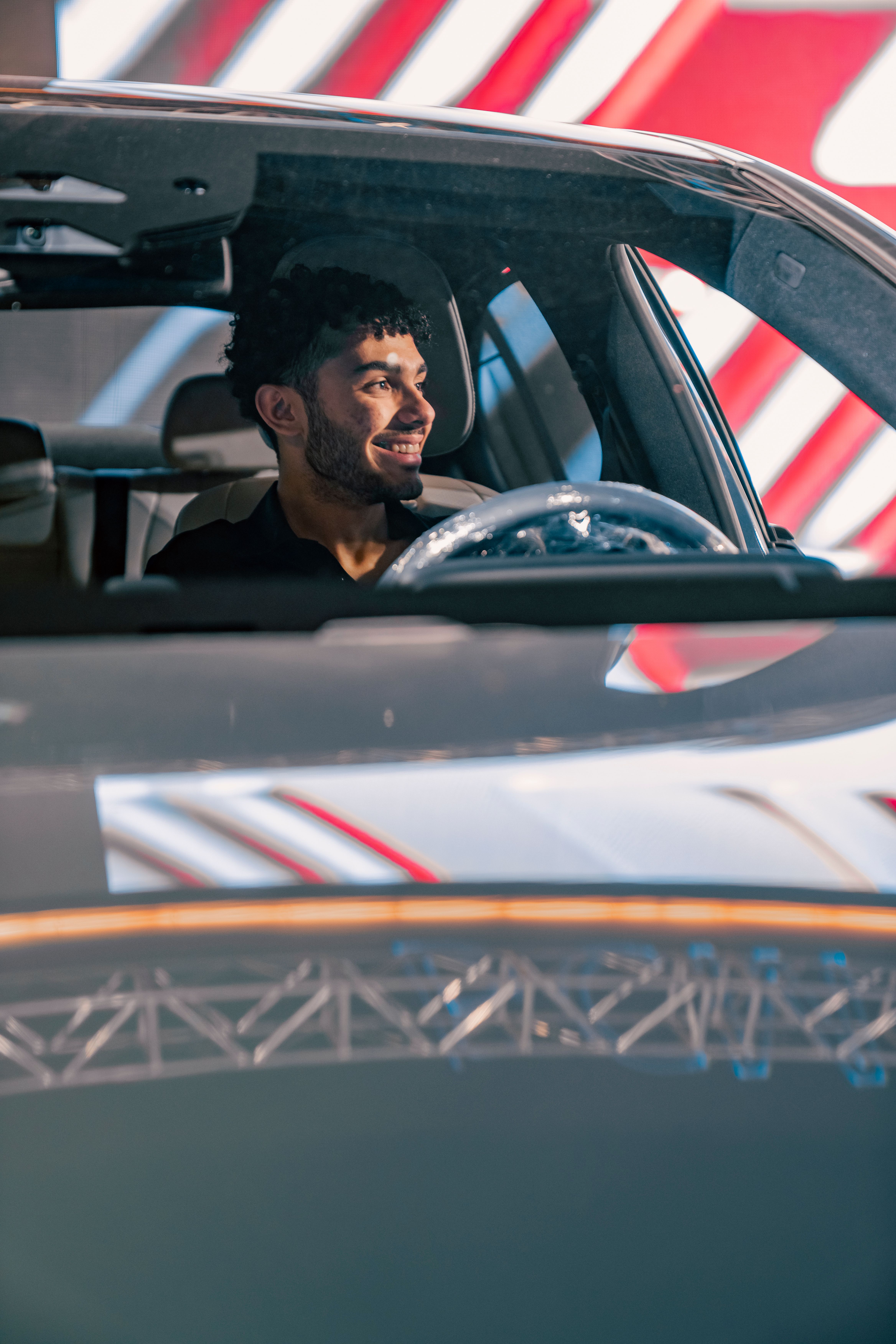 Man Sitting behind a Wheel · Free Stock Photo