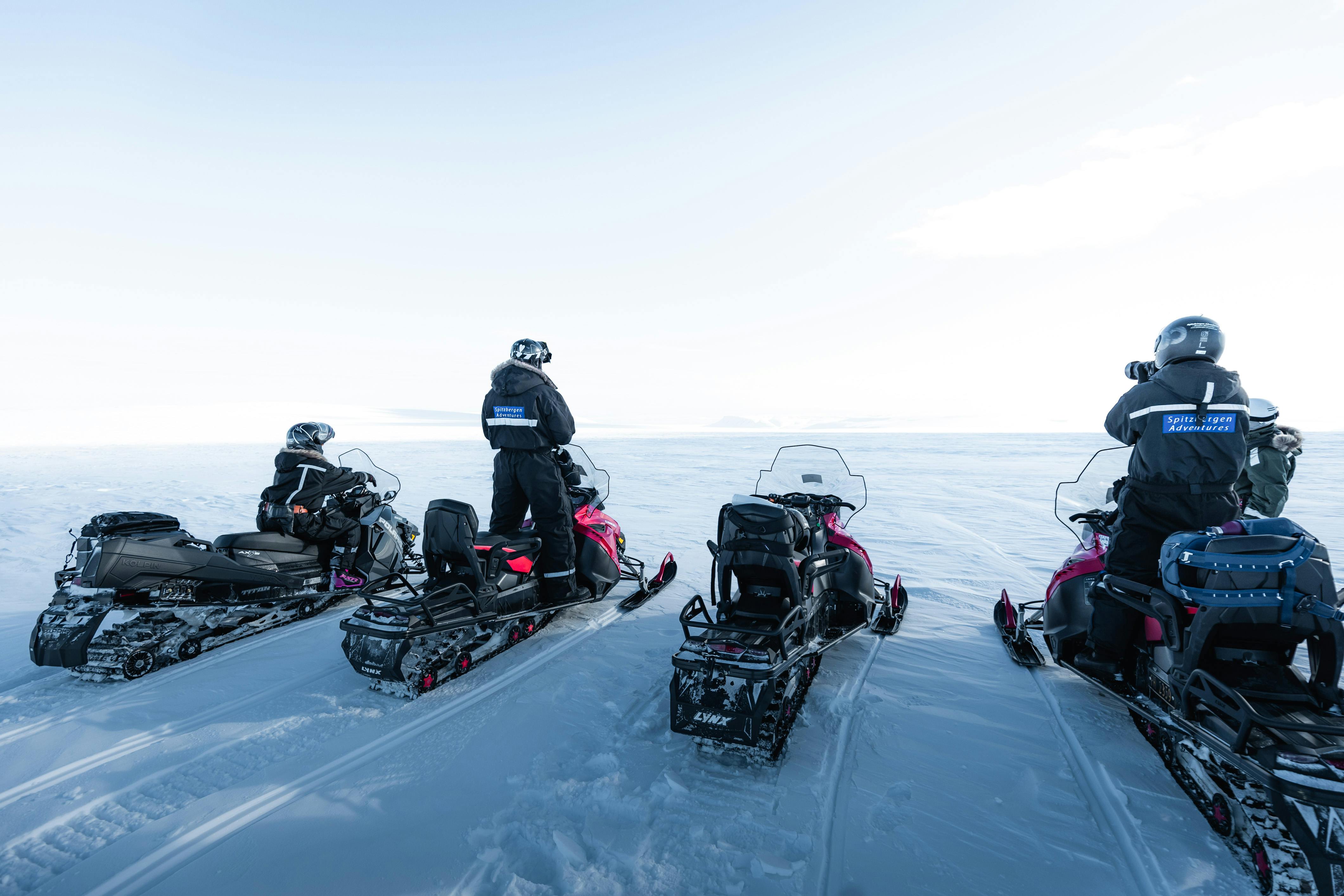 Group of Tourists on Snowmobiles · Free Stock Photo