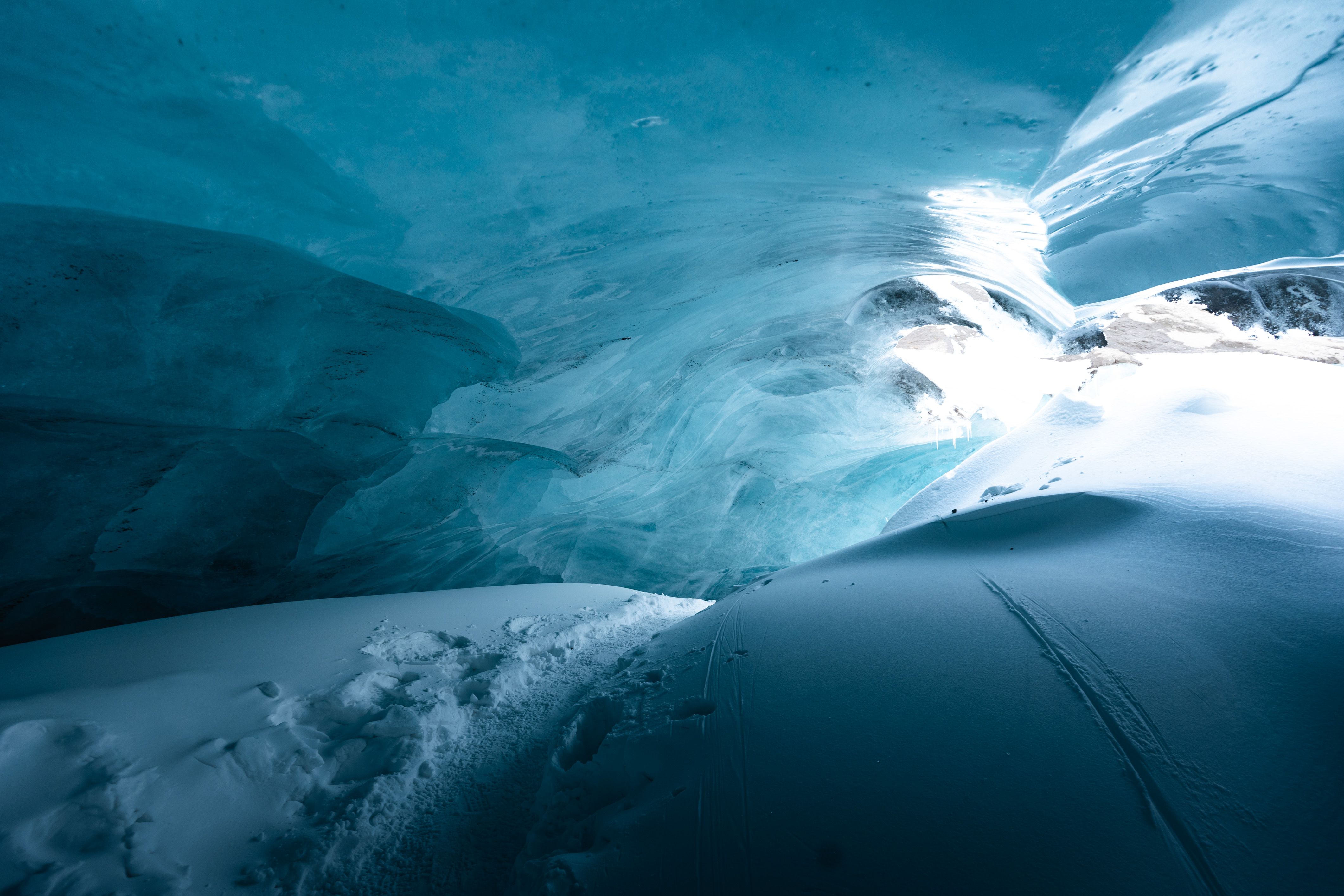 A blue ice cave with snow and ice · Free Stock Photo