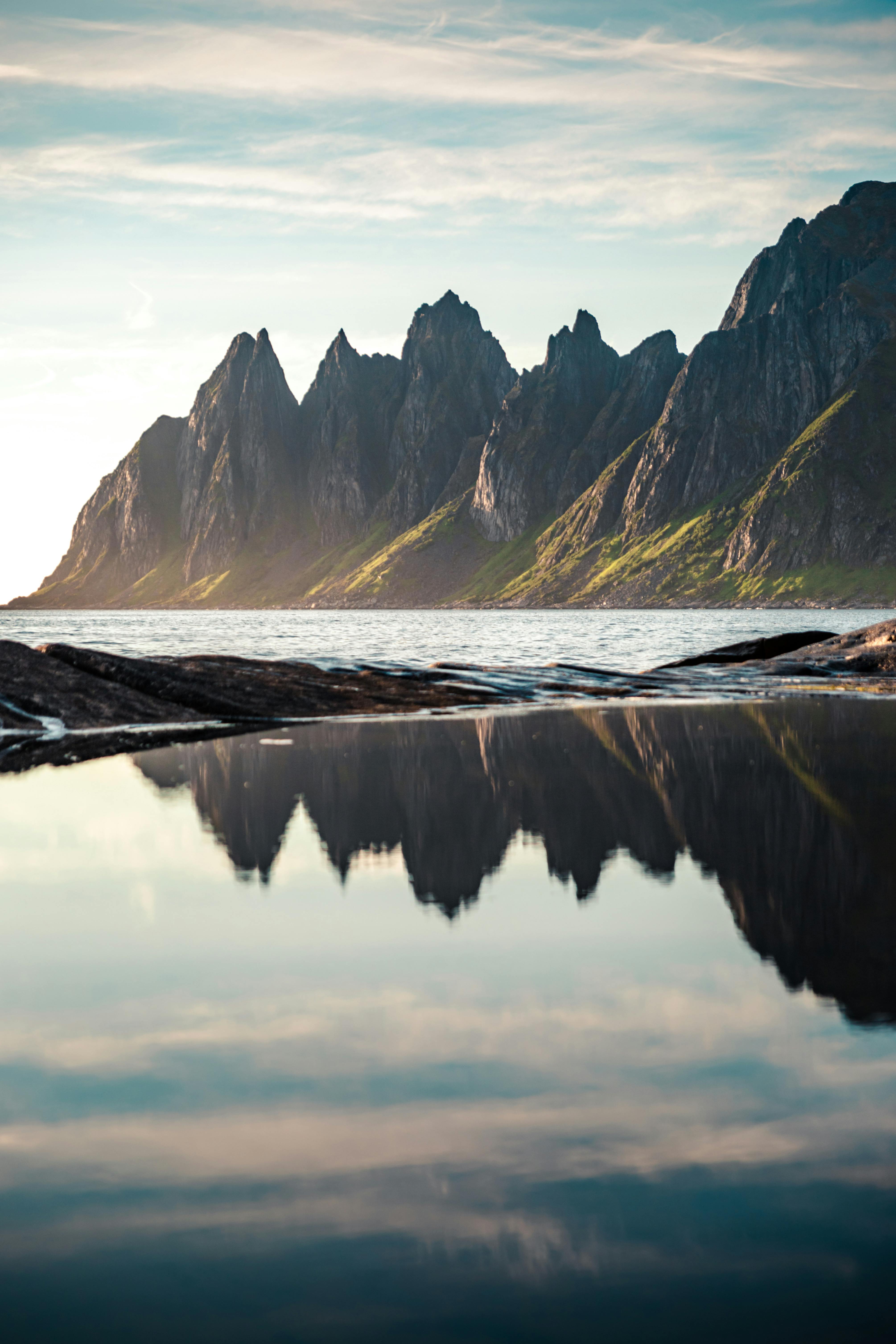 Mountain Range Near Body of Water · Free Stock Photo
