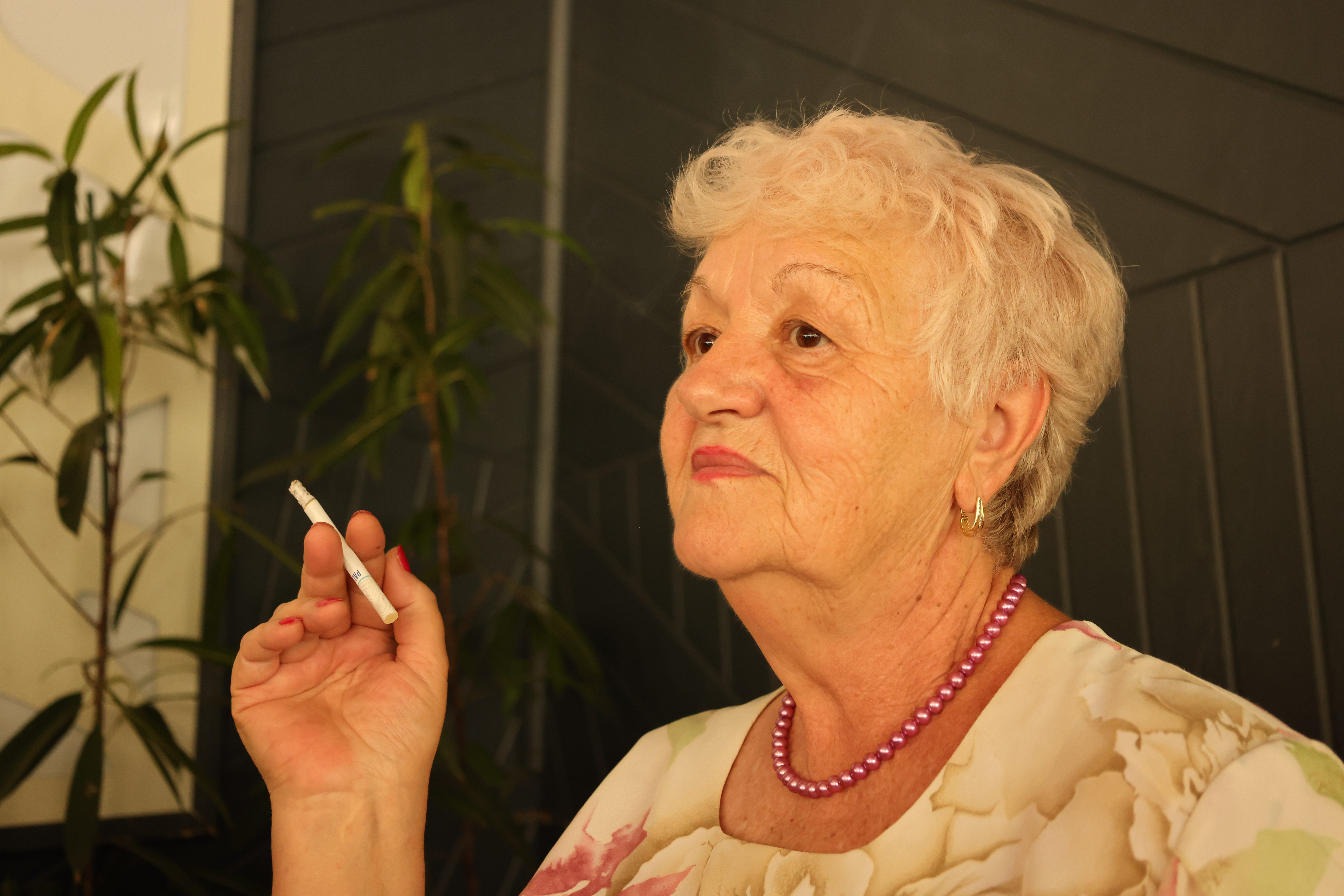 Beautiful Brunette Woman Smoking Cigarette · Free Stock Photo
