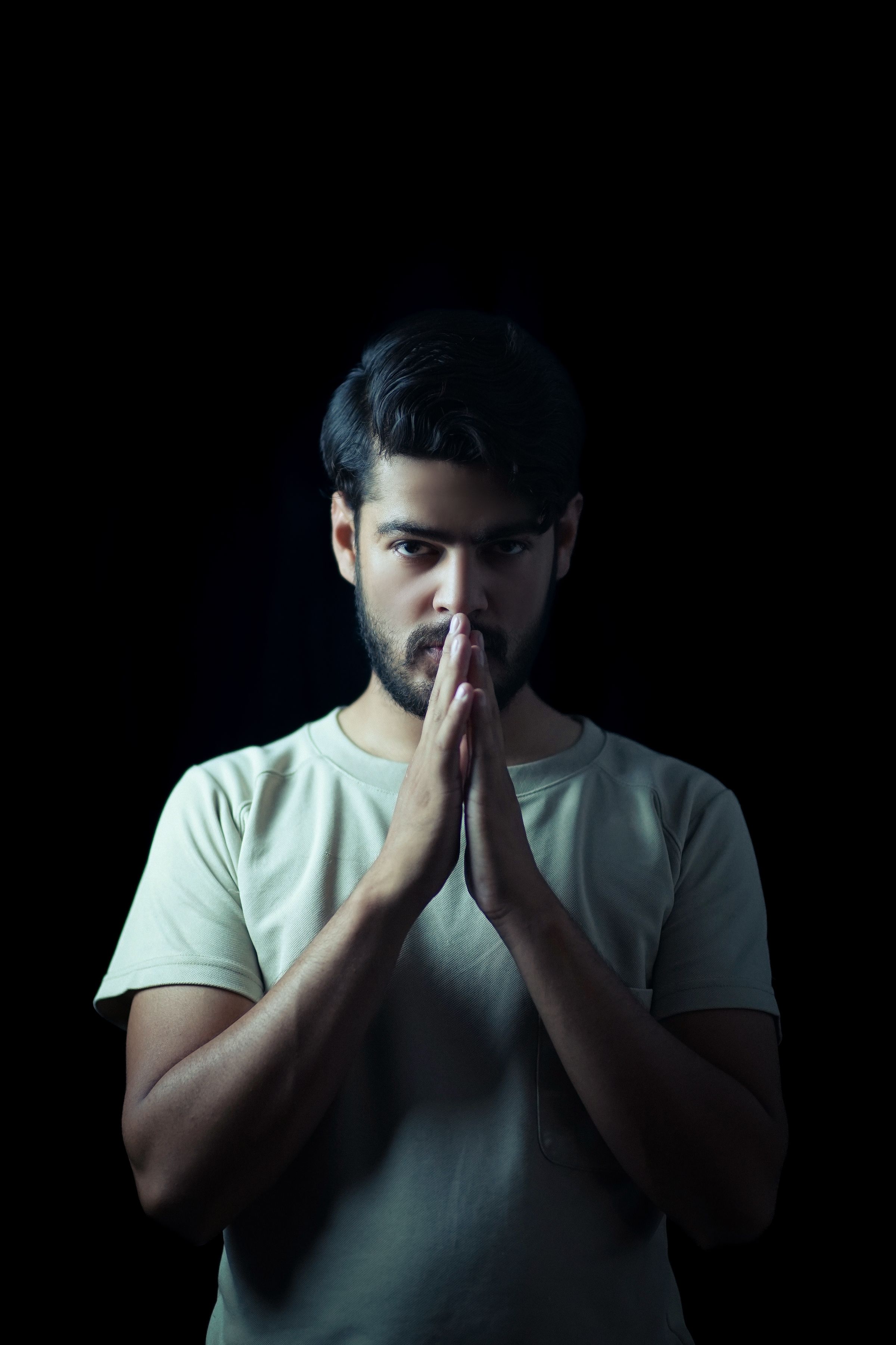 Man Praying with Prayer Beads · Free Stock Photo