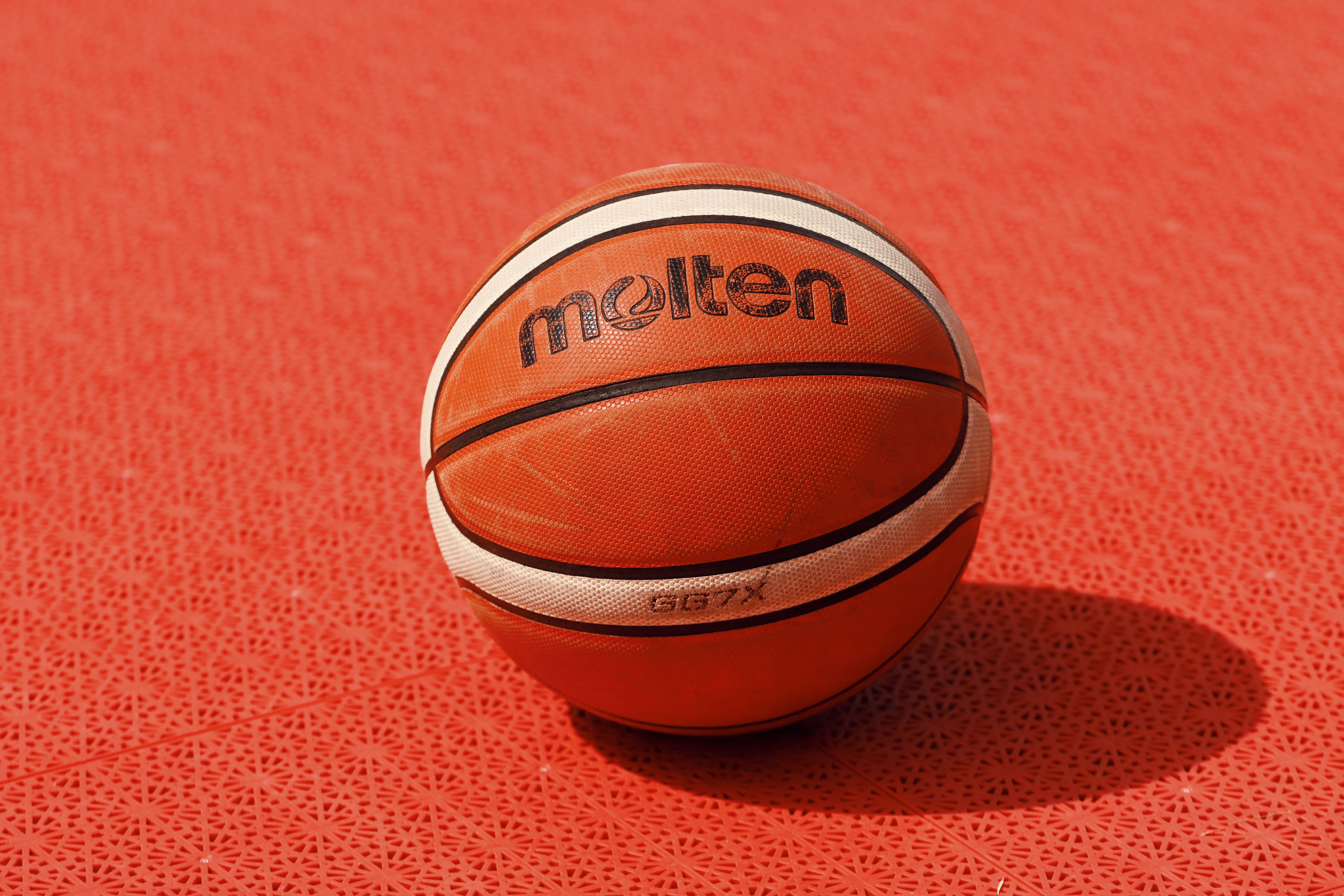 Basketball Ball on Red Background · Free Stock Photo