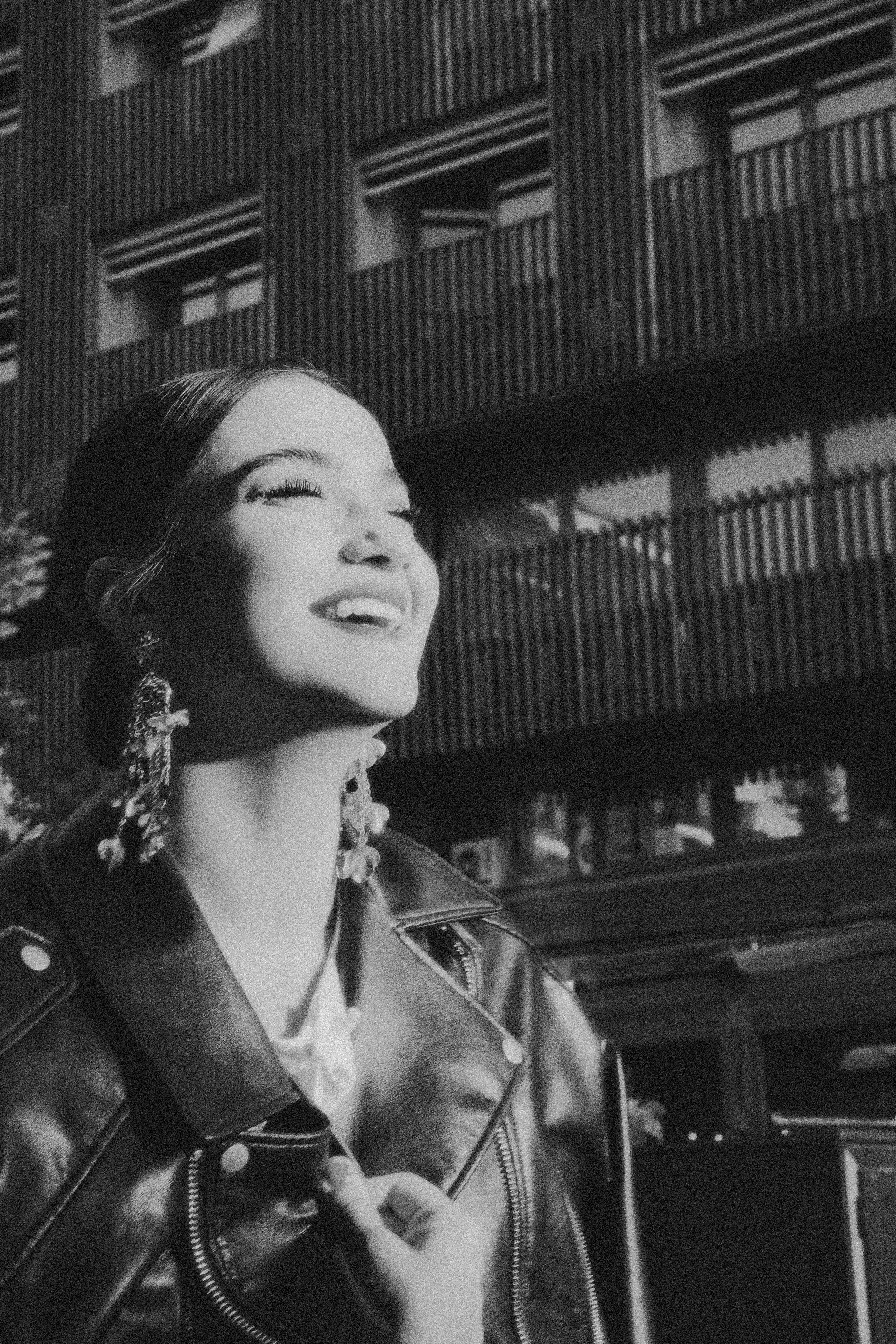 Laughing Woman in Leather Jacket · Free Stock Photo
