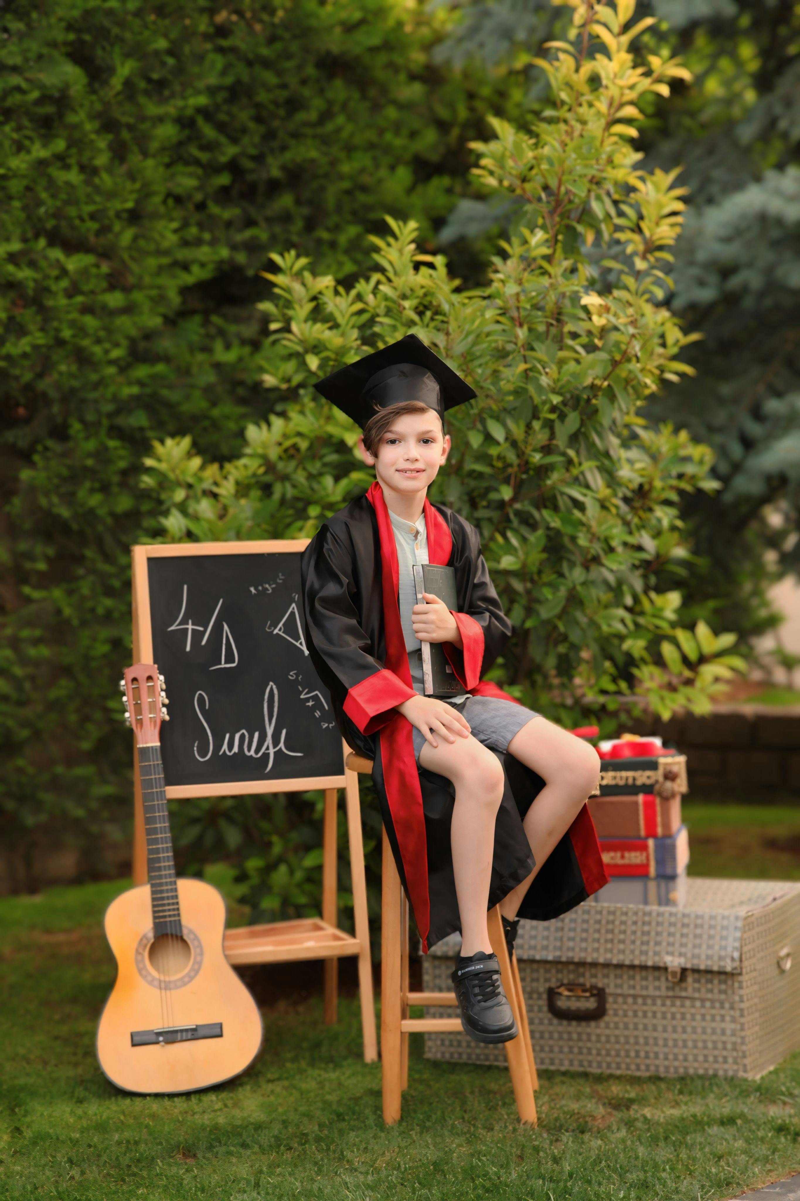 Boy in Graduation Gown · Free Stock Photo