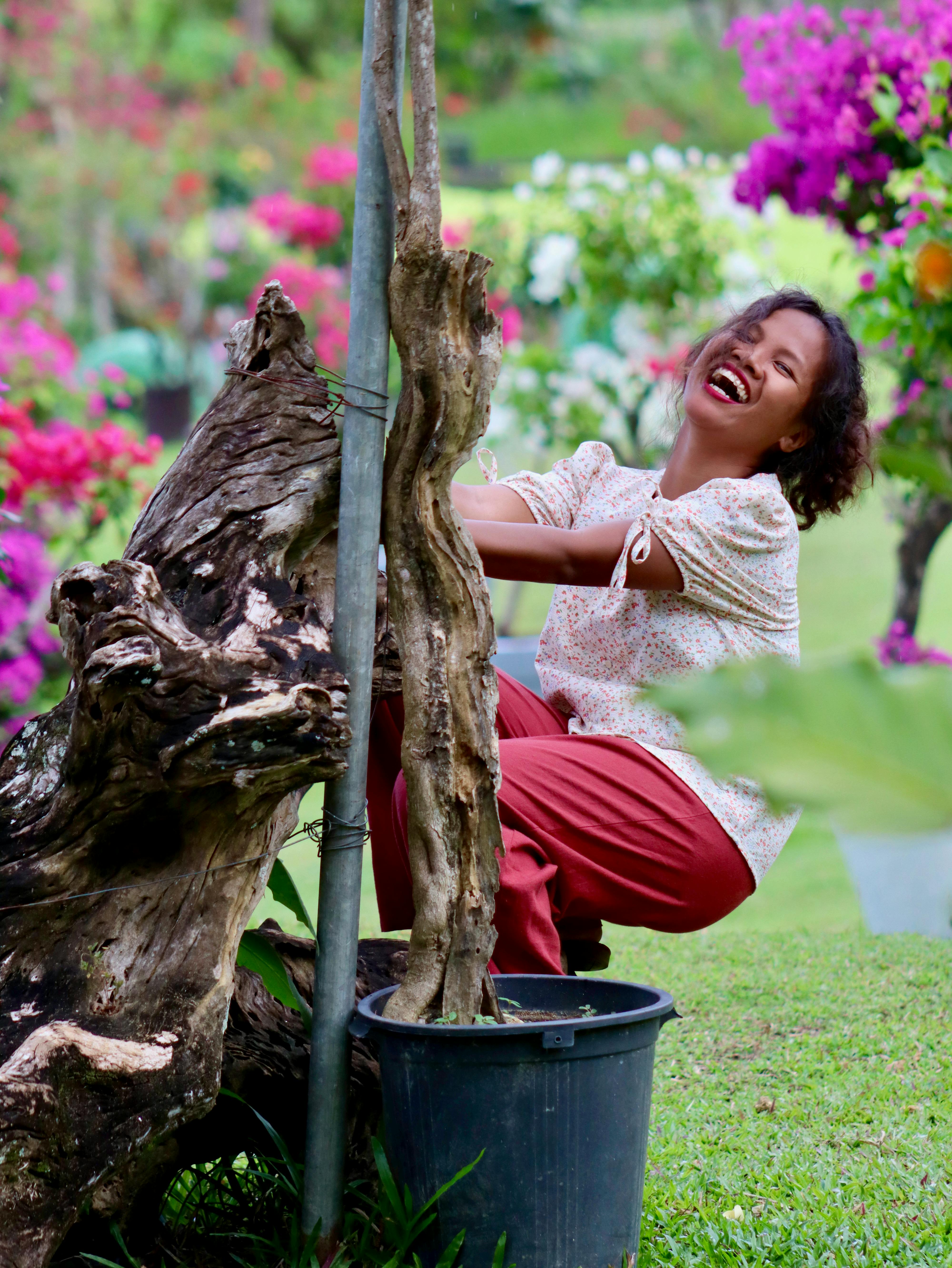 A Laughing Woman in a Garden · Free Stock Photo