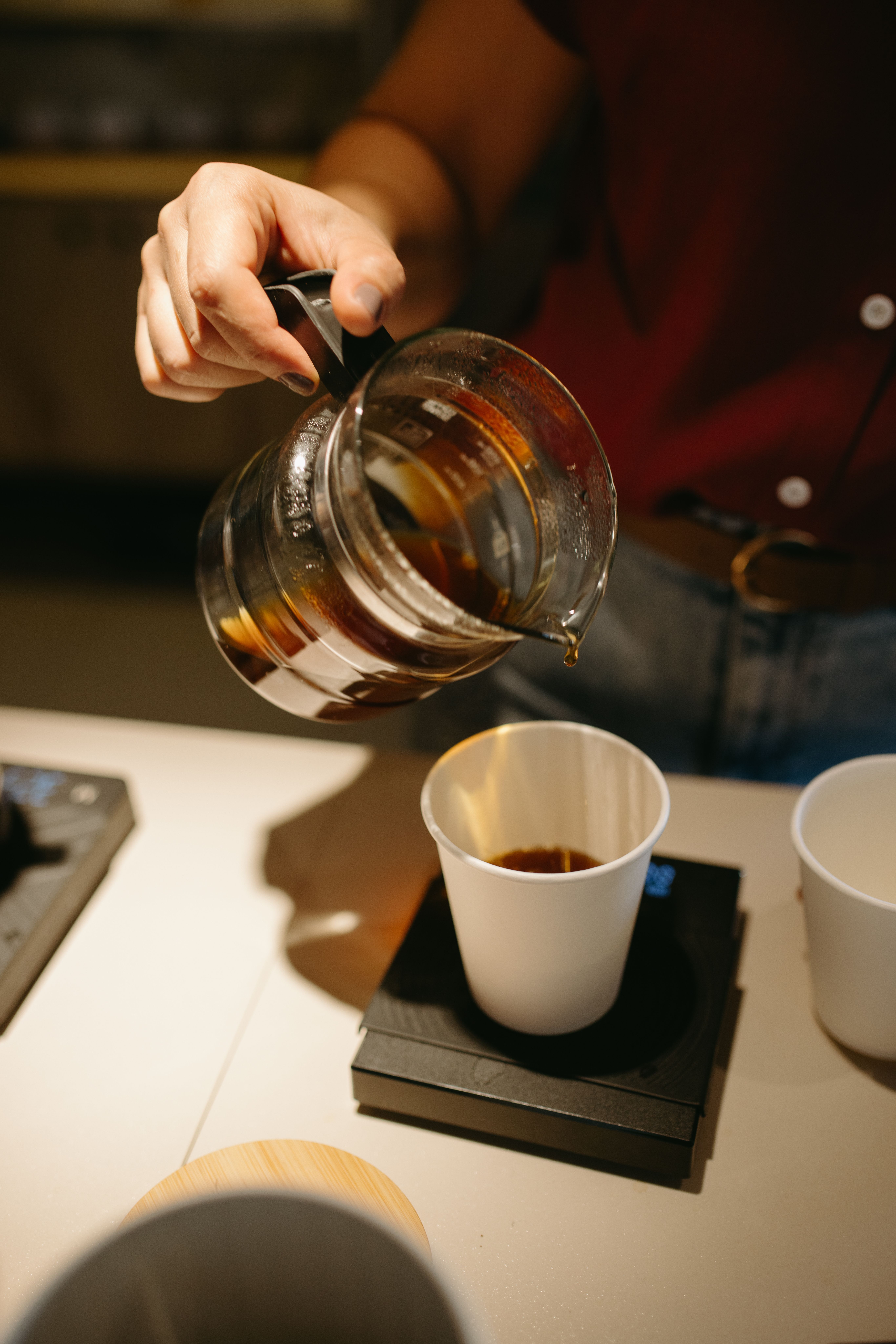 Person Pouring Coffee to a Paper Cup · Free Stock Photo