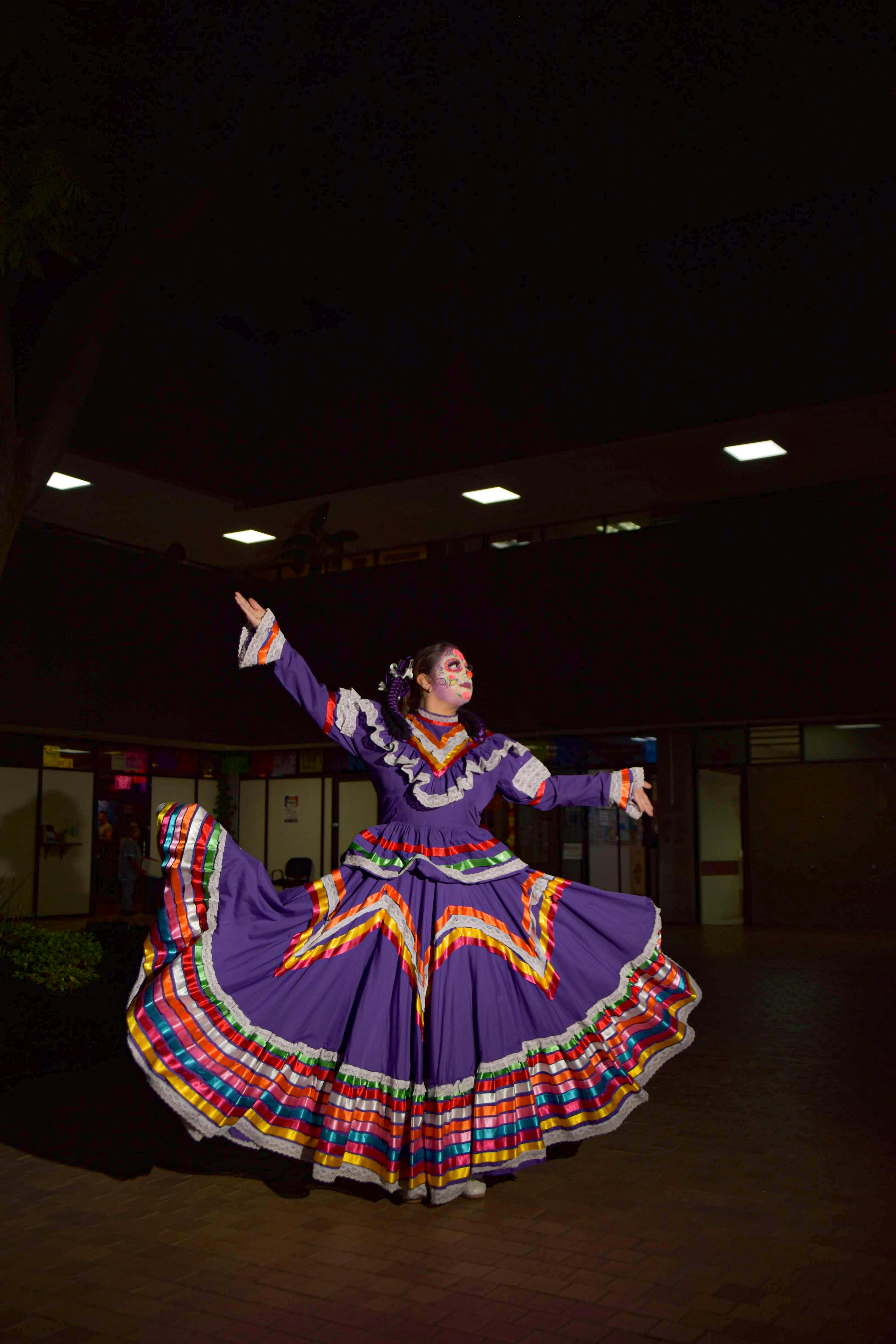 Woman as Catrina Dancing in Purple Dress · Free Stock Photo