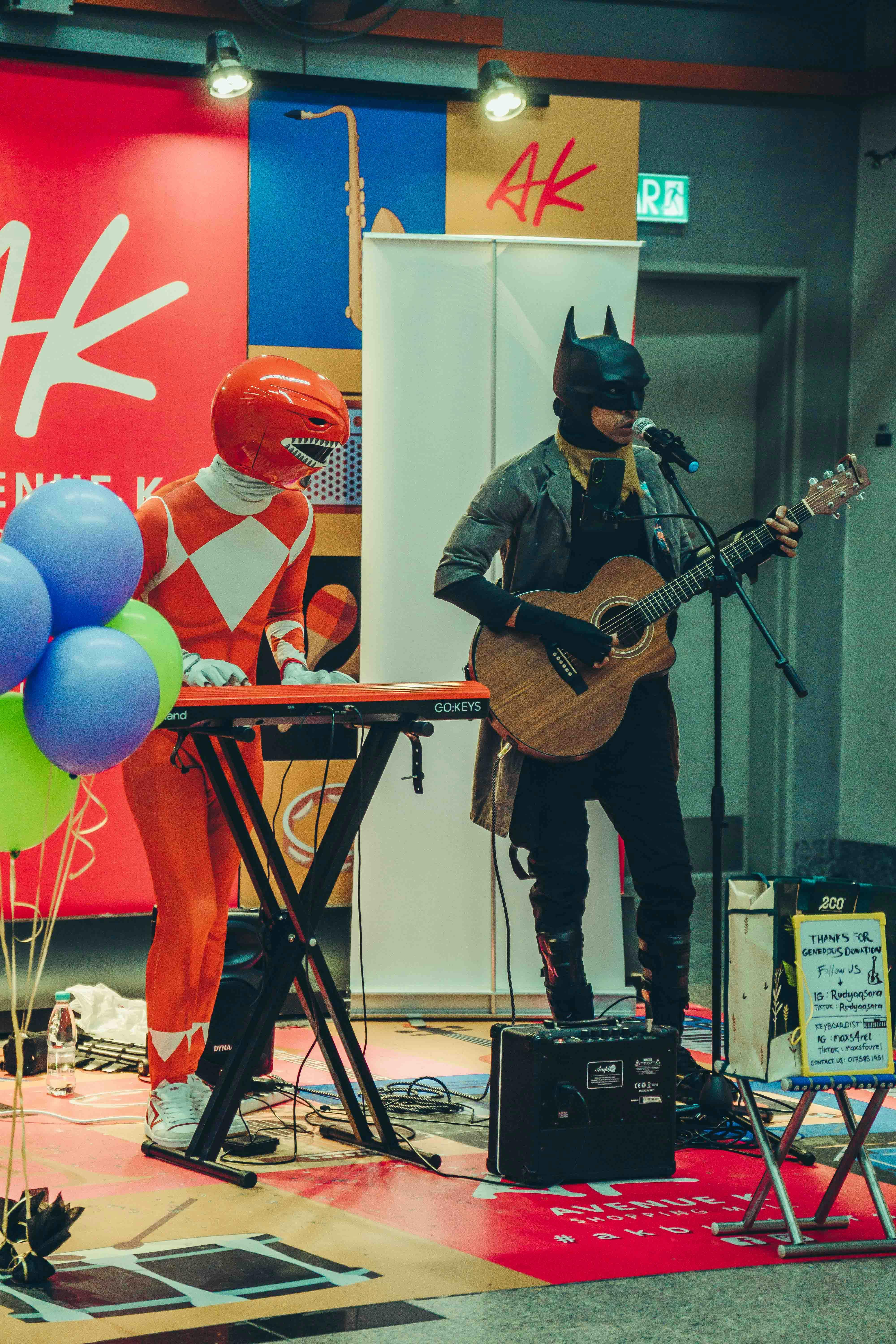 Batman and Red Power Ranger Playing at Birthday Party · Free Stock Photo