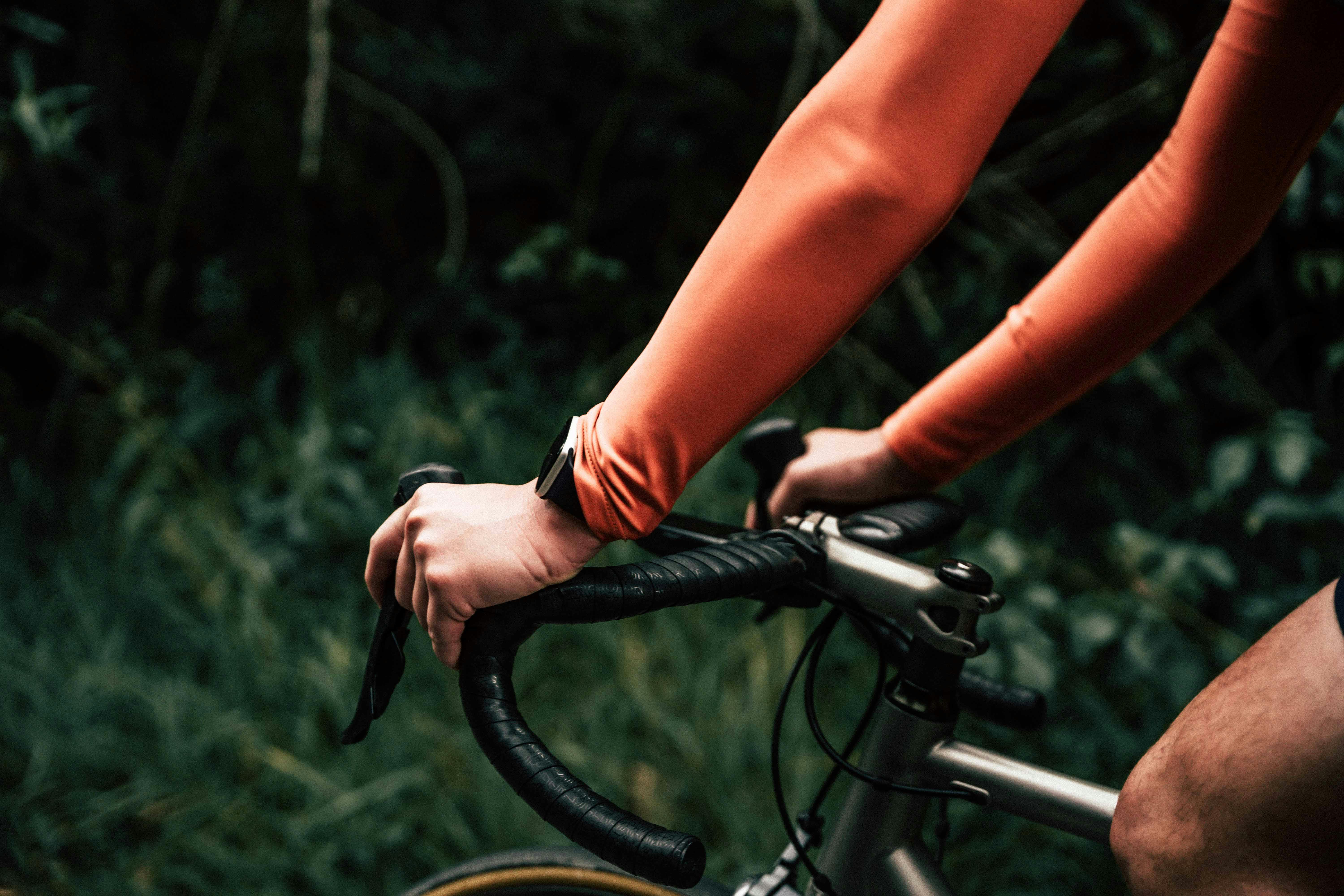 Cyclist Arms on Road Bike Handlebar · Free Stock Photo