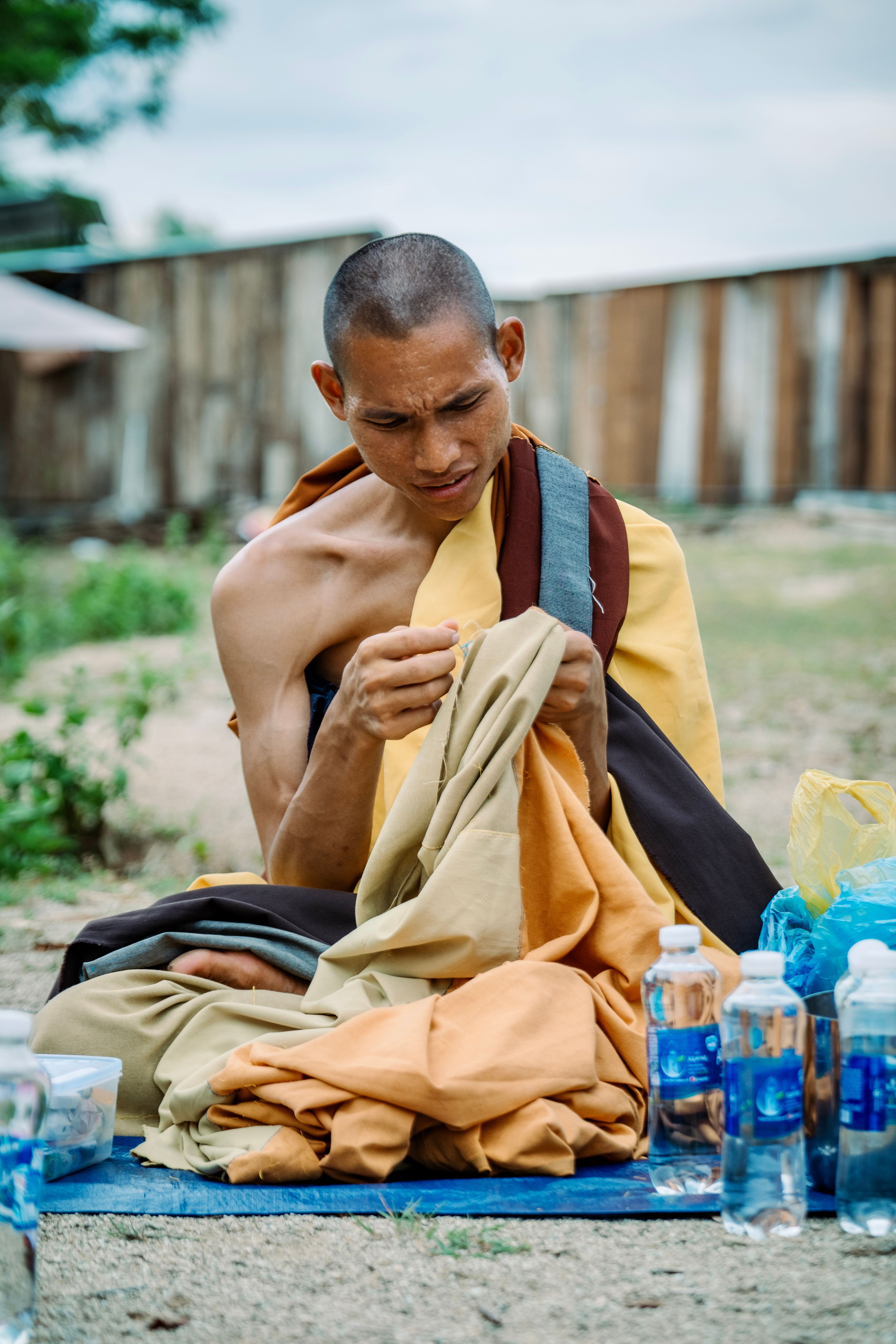 Monk Sitting on a Mat · Free Stock Photo