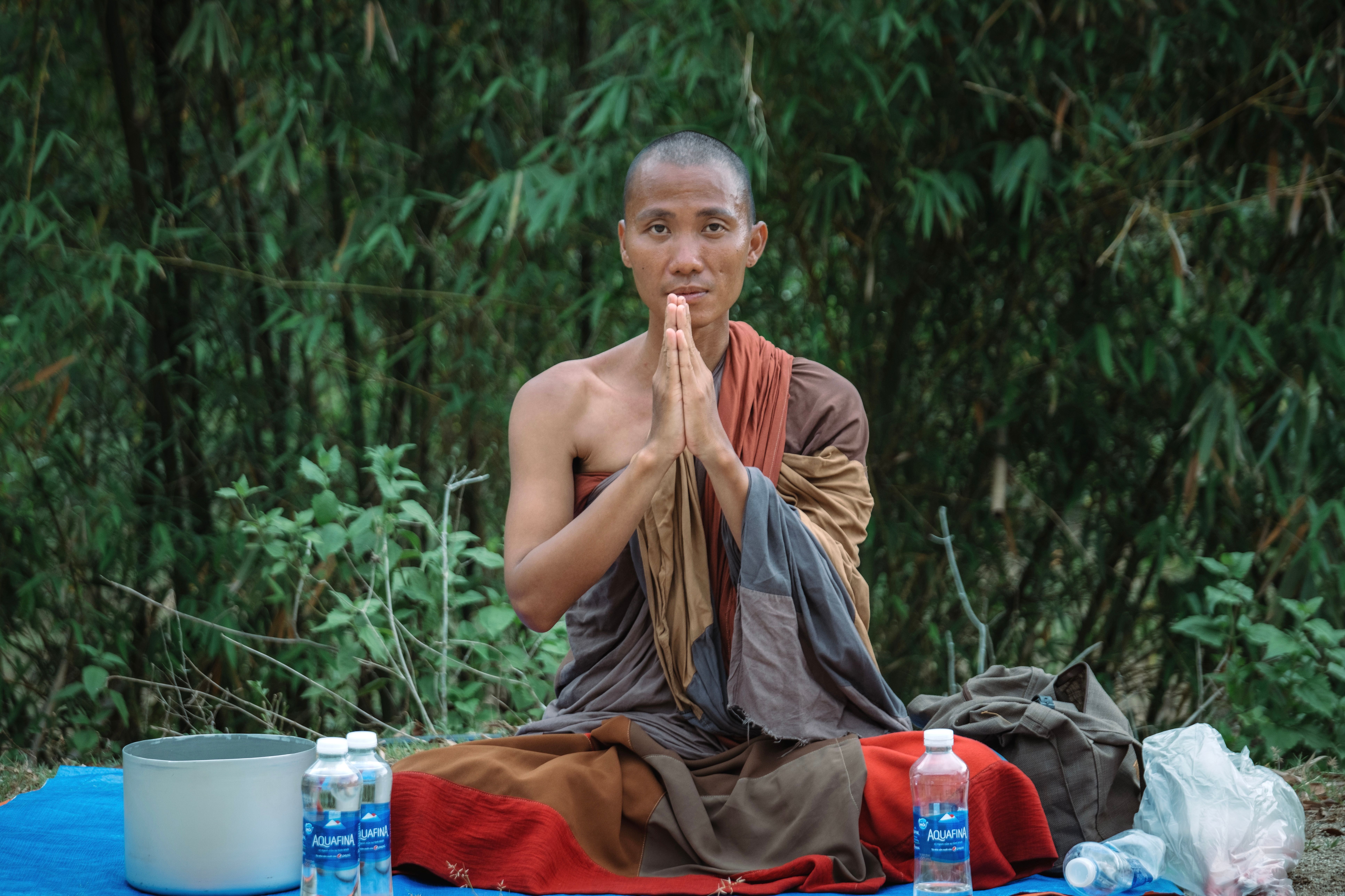 Selective Focus Photography of Monk during Meditation · Free Stock Photo