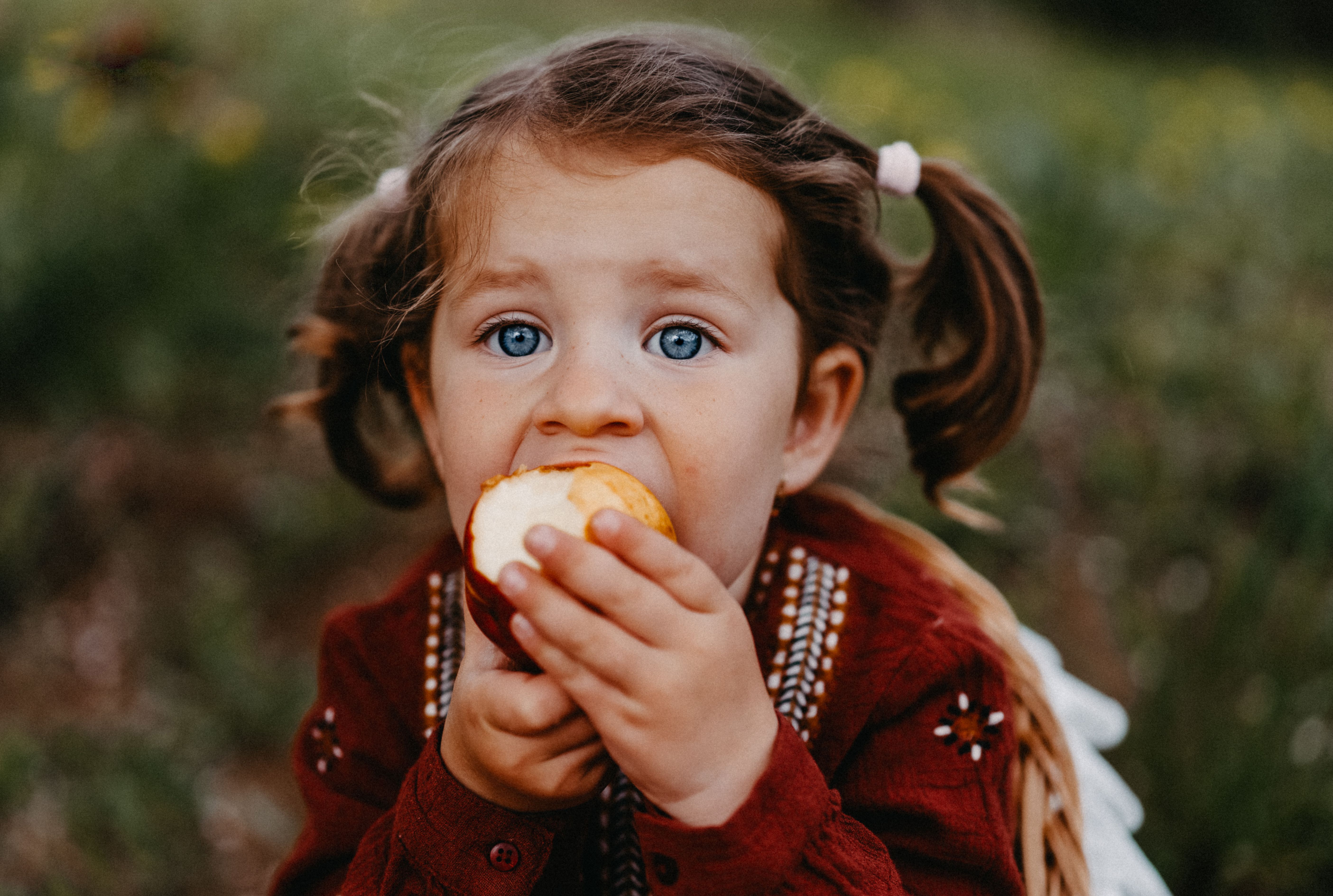 Portrait of Girl Eating Apple · Free Stock Photo