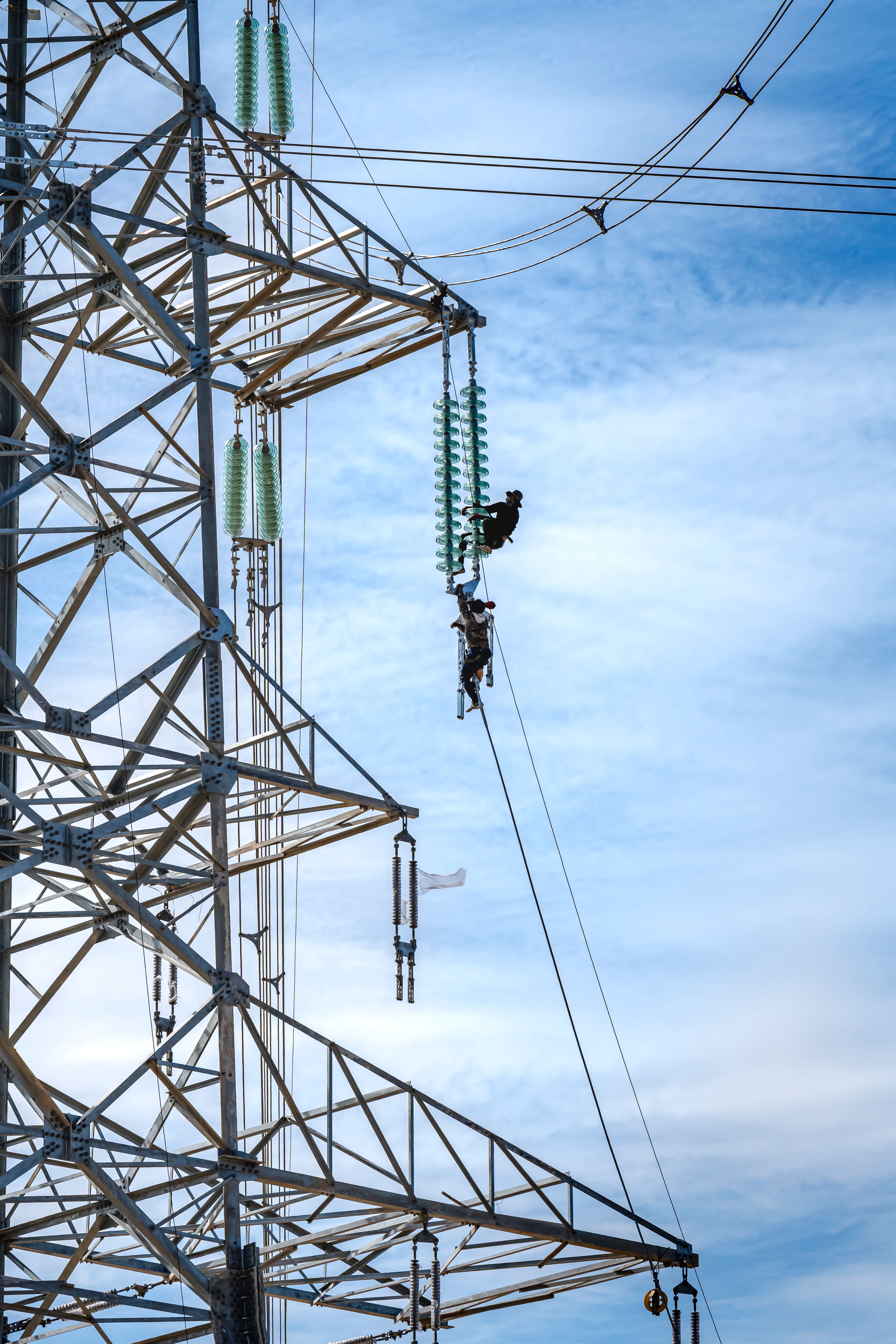Men Working on Transmission Tower · Free Stock Photo