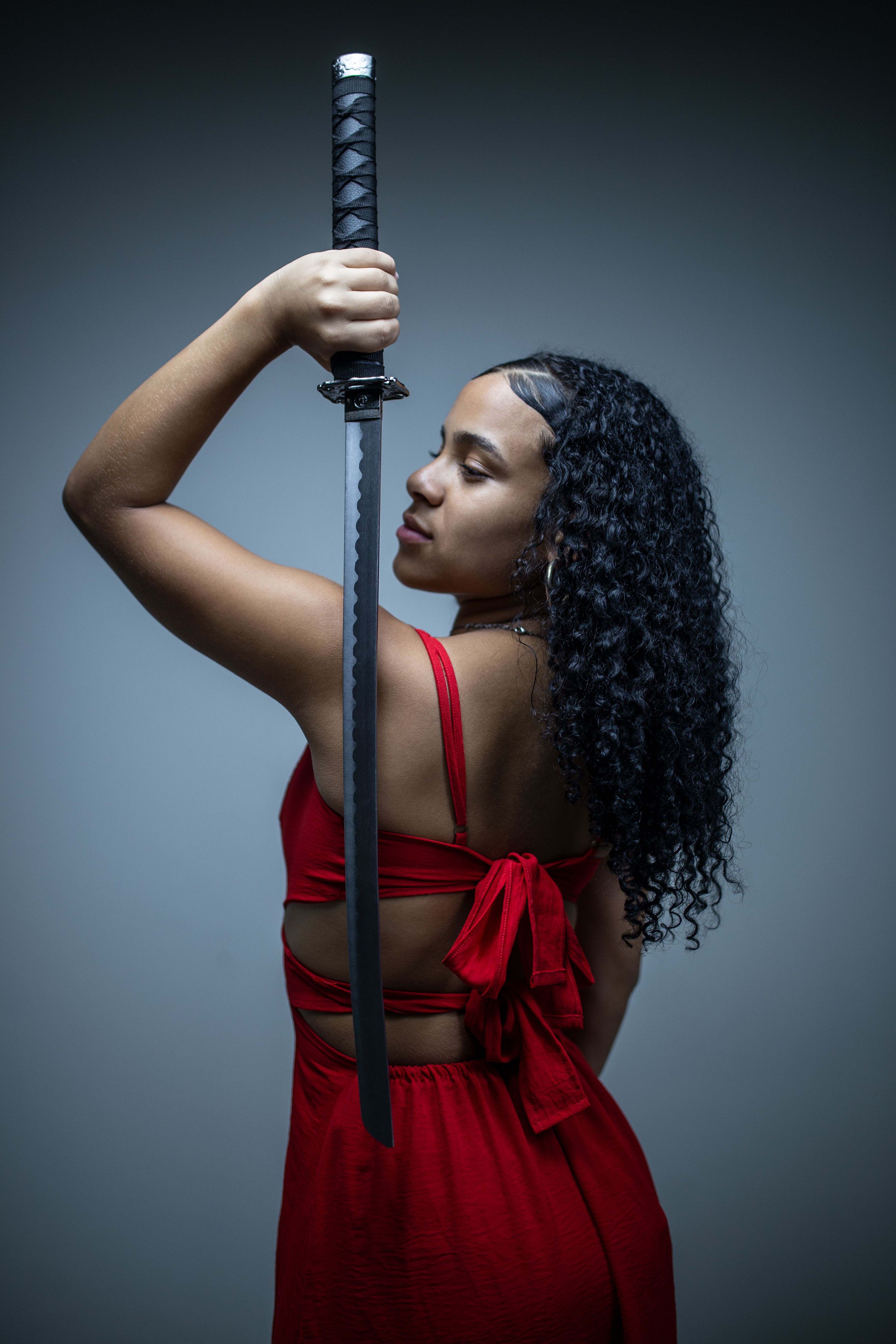 Brunette Woman in Red Dress Standing with Sword · Free Stock Photo