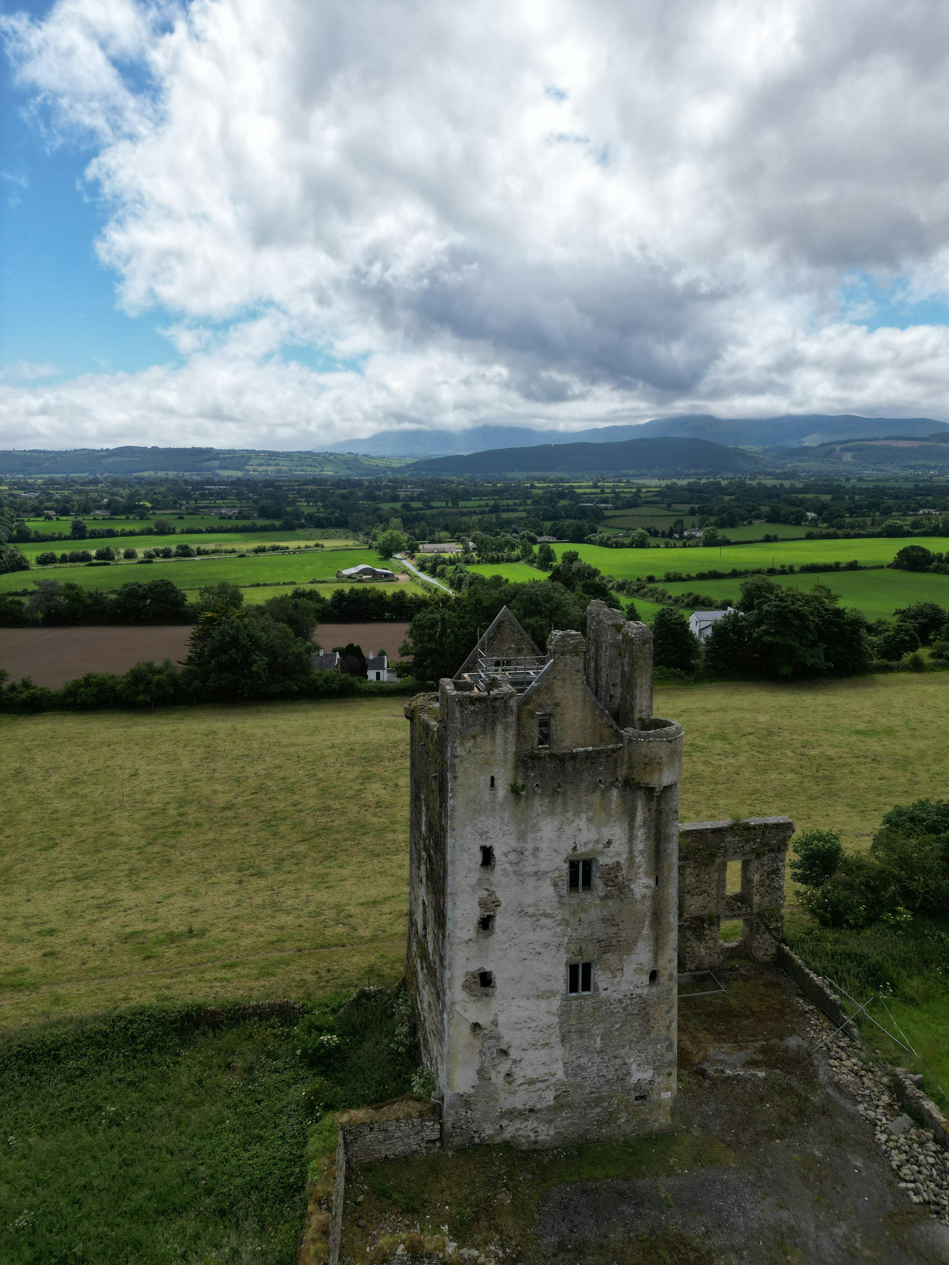 Old Ruin with Countryside Fields in the Background · Free Stock Photo