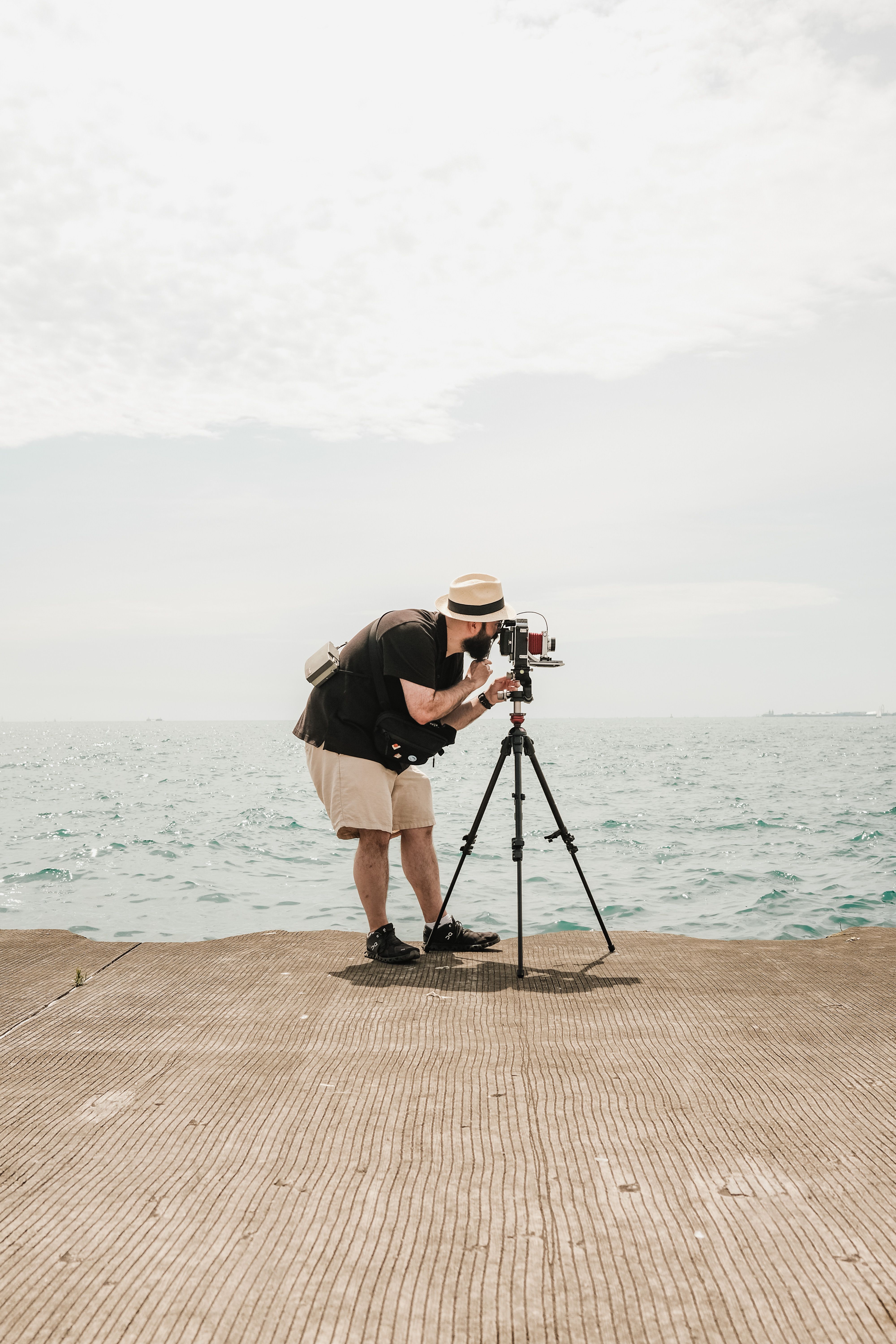 Photographer by Sea · Free Stock Photo