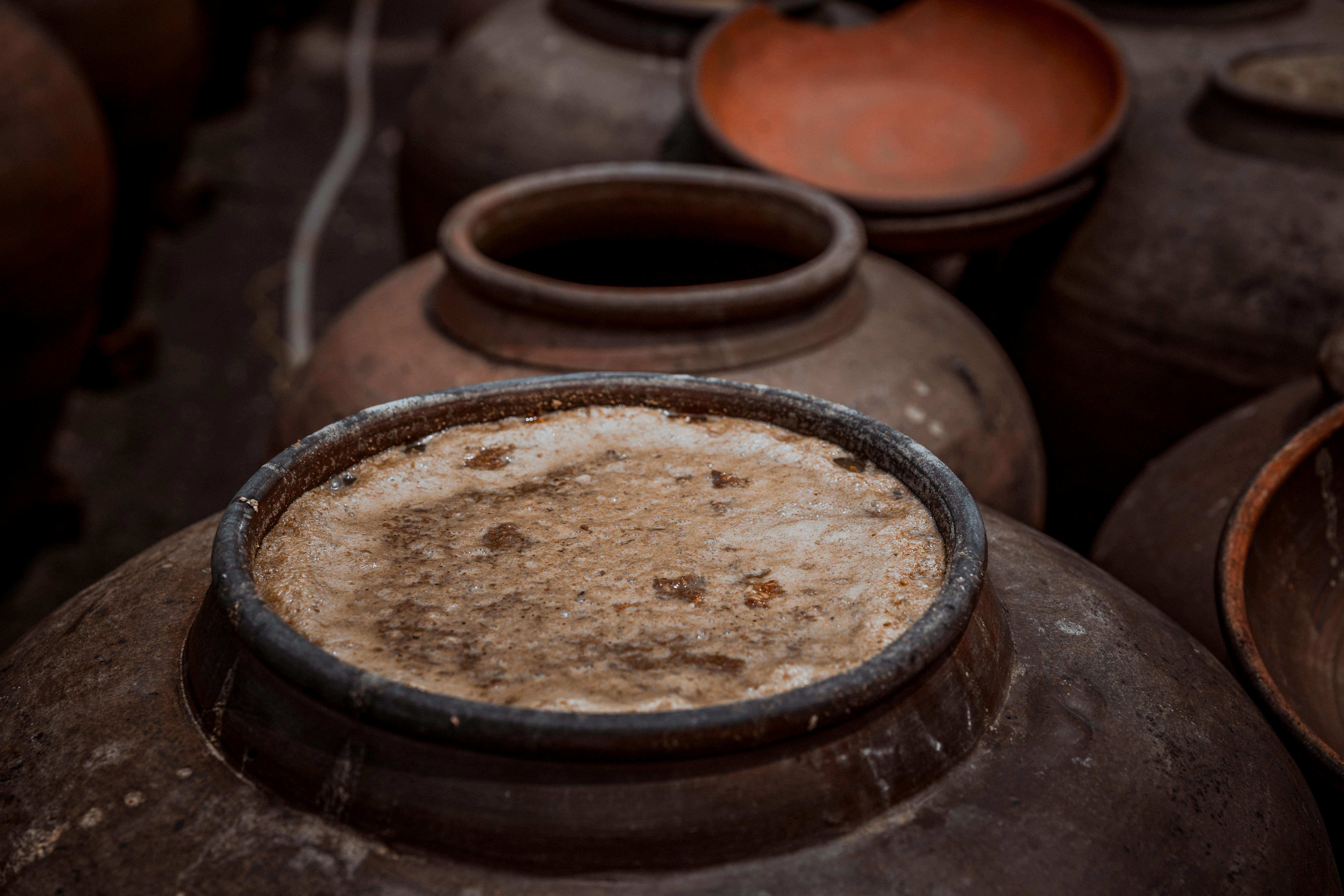 Liquid in a Brown Ceramic Pot · Free Stock Photo