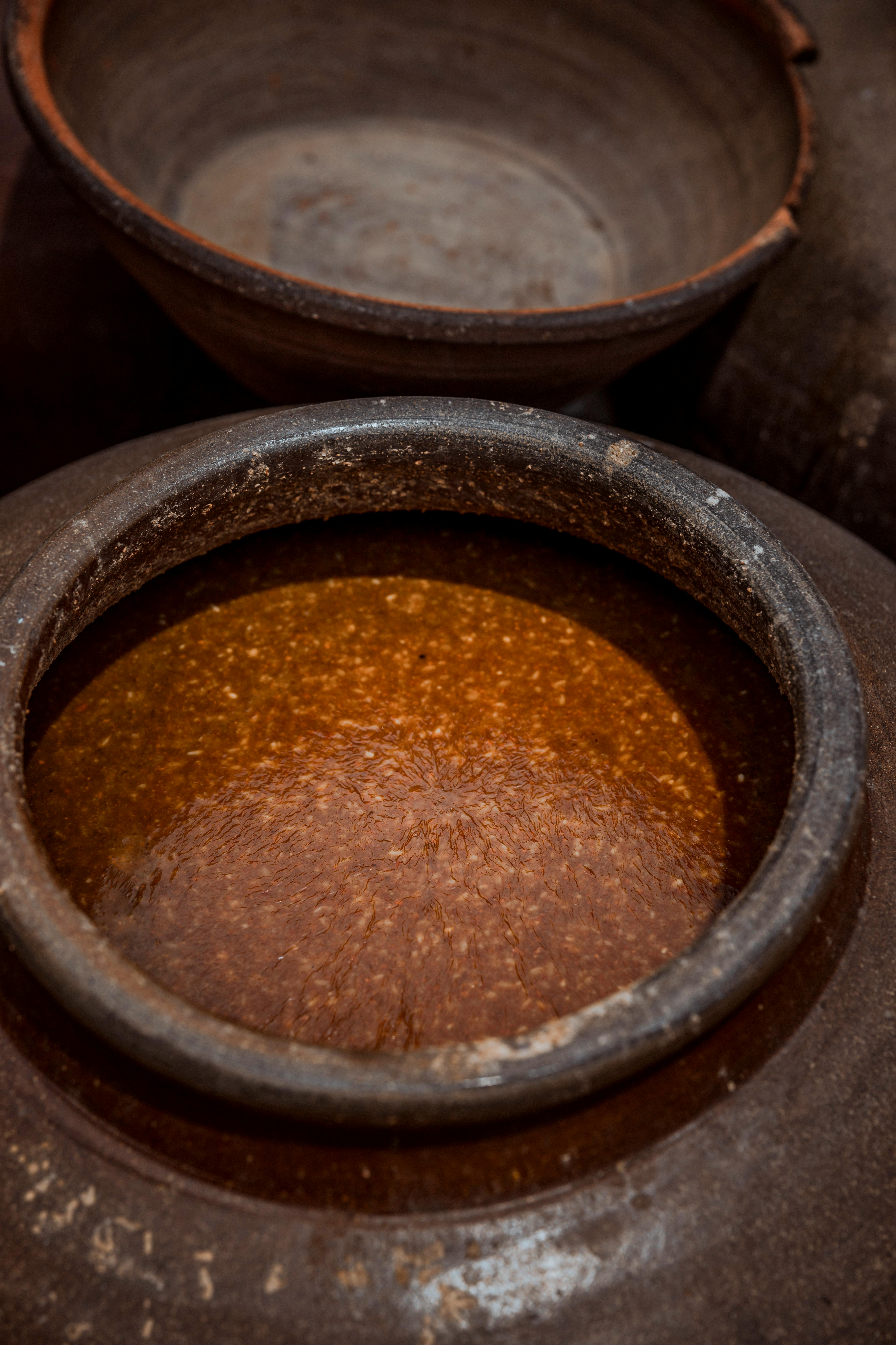 Liquid in a Brown Ceramic Pot · Free Stock Photo