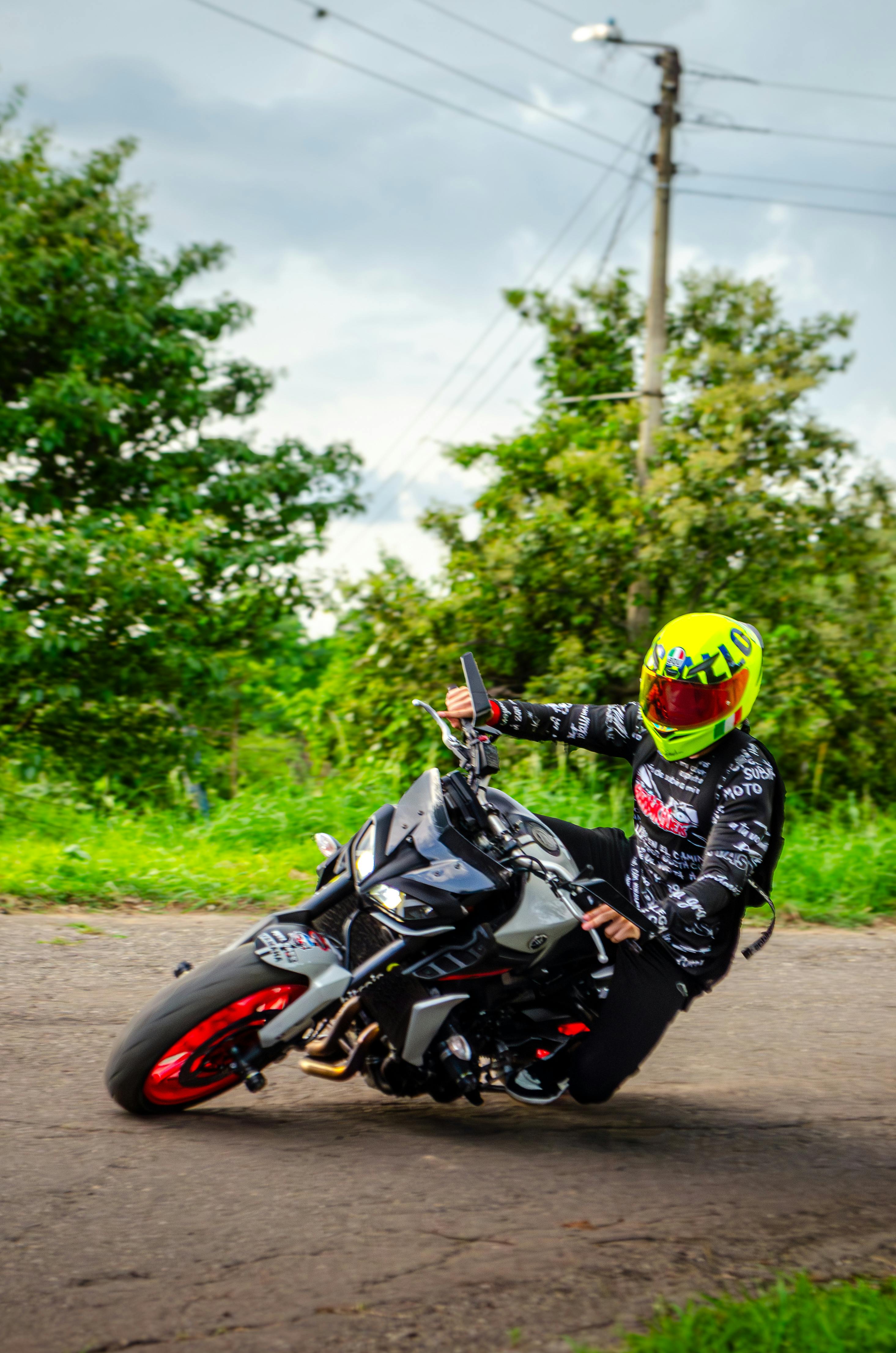 Person Riding Motorcycle on Road · Free Stock Photo