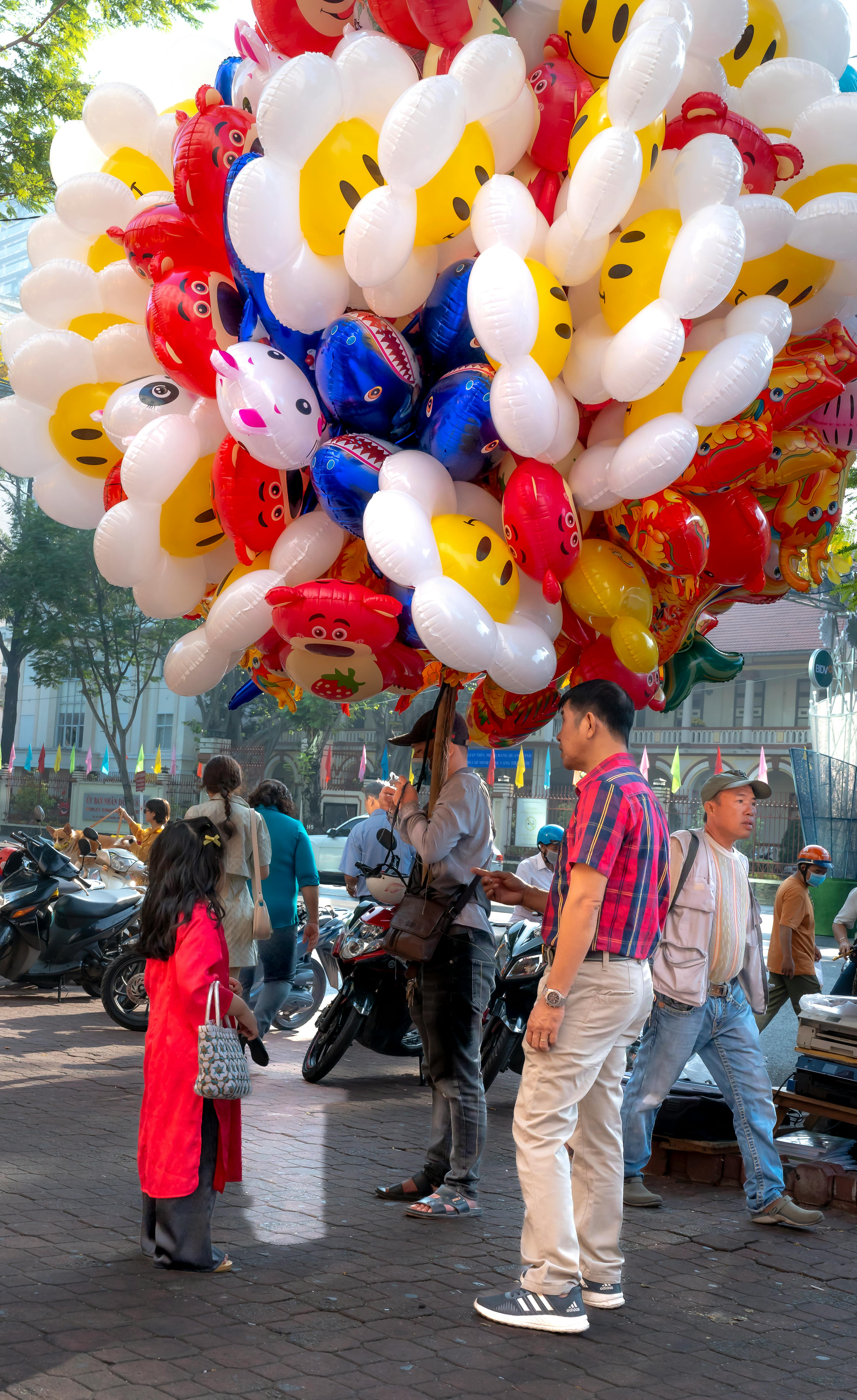 A Man Selling Balloons on the Street · Free Stock Photo