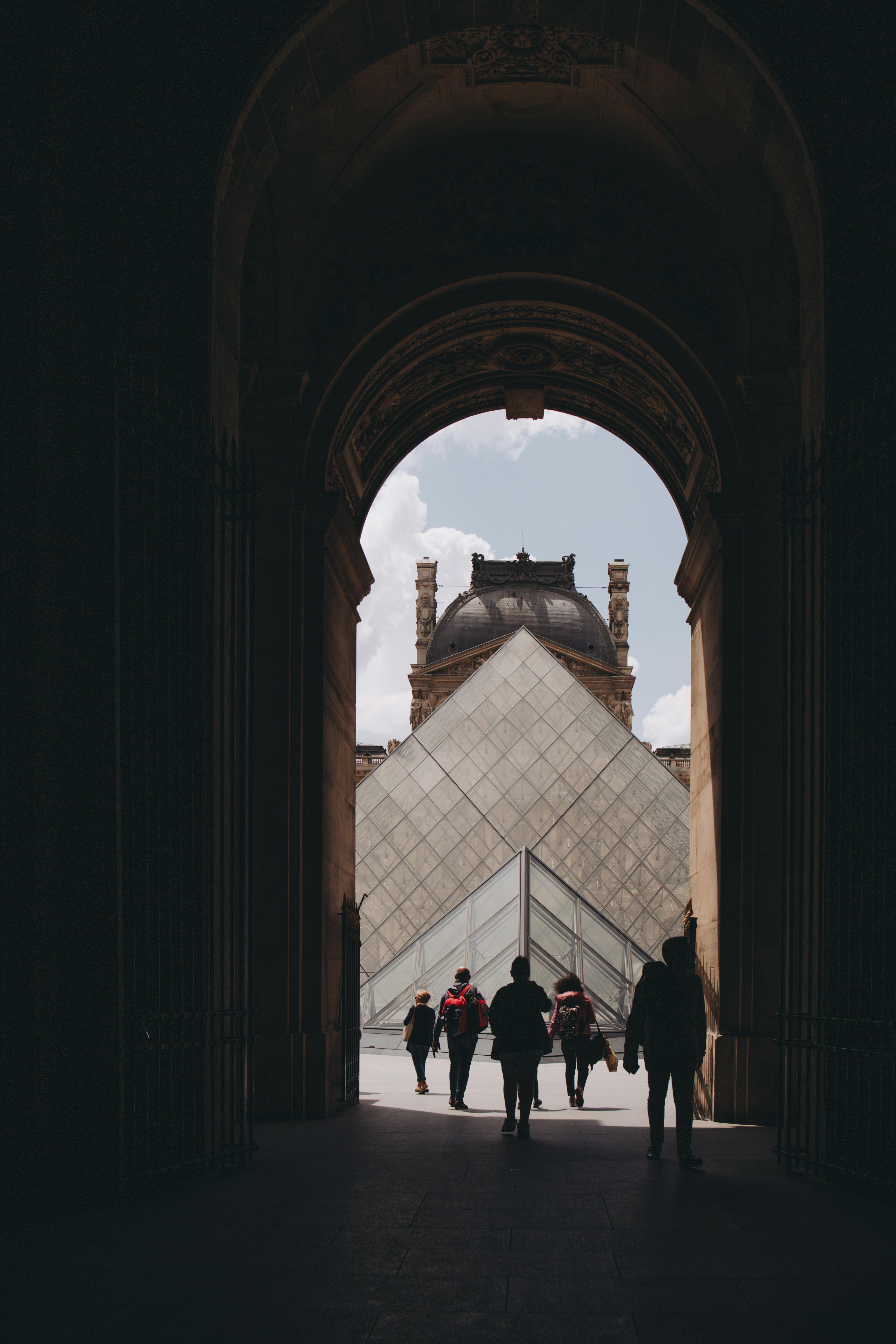 People Walking through Gate towards Louvre Pyramid · Free Stock Photo