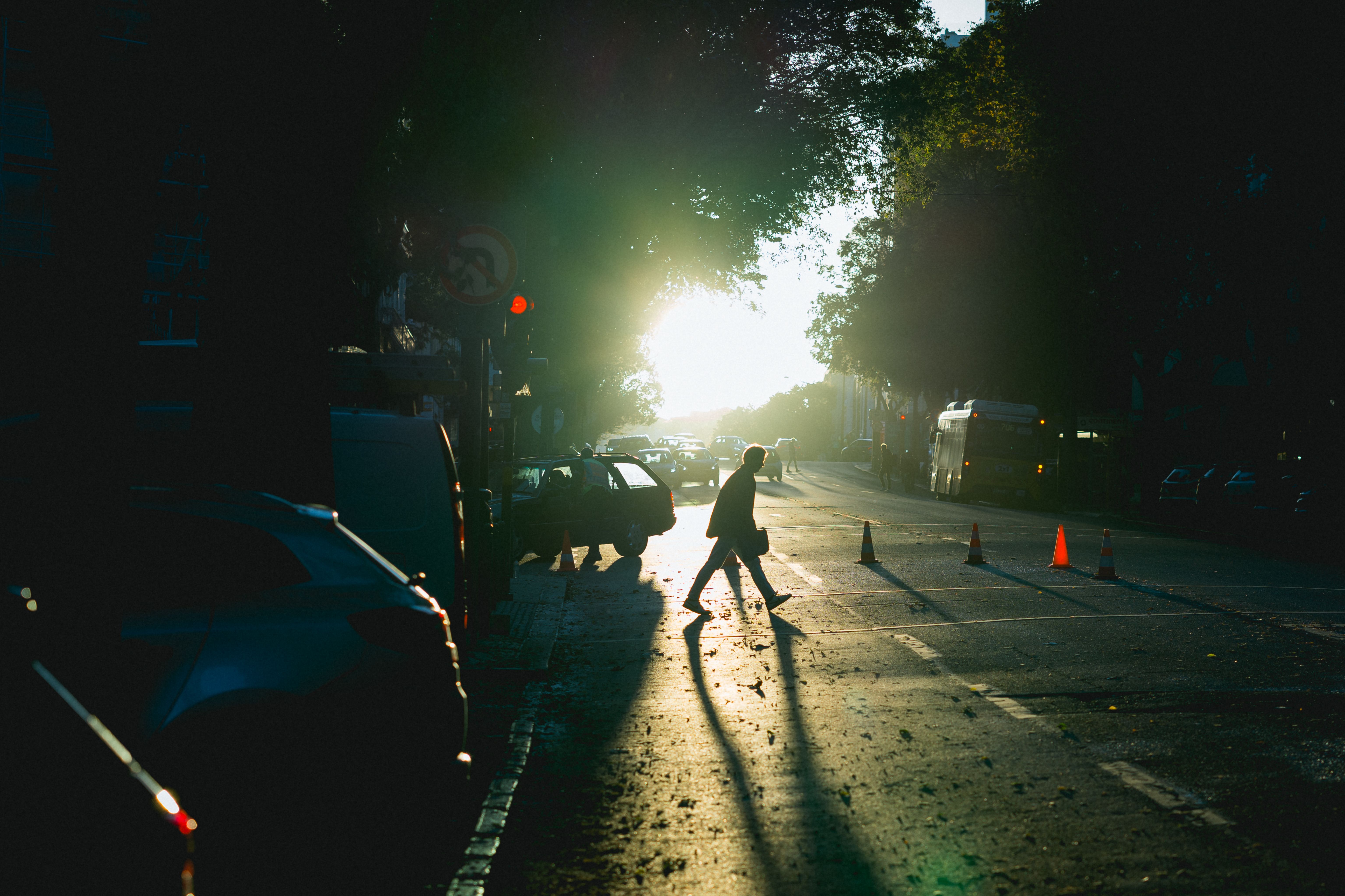 Man Crossing the Road at Sunset · Free Stock Photo