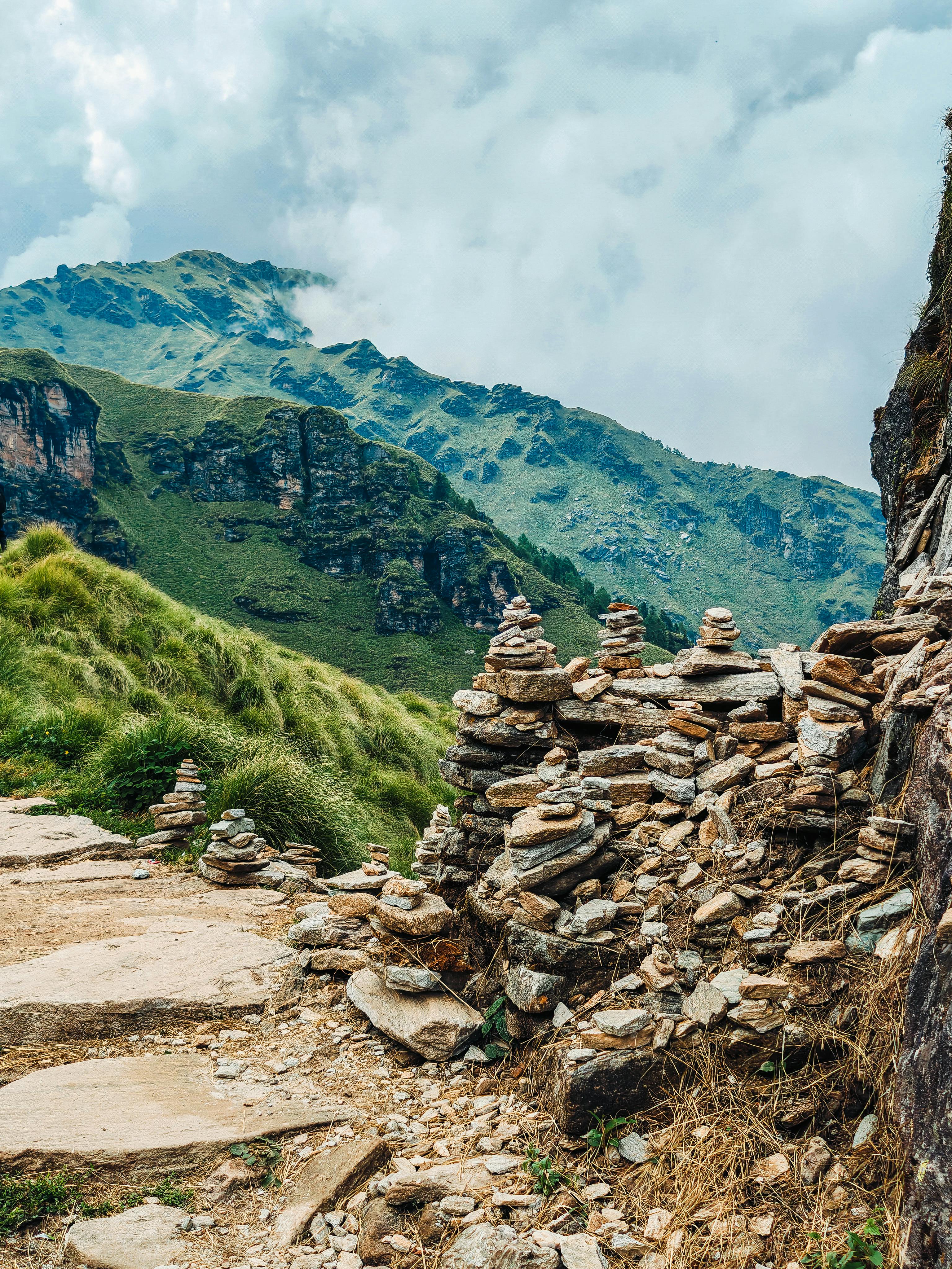 Stone Stacks by a Tourist Trail in the Mountains · Free Stock Photo
