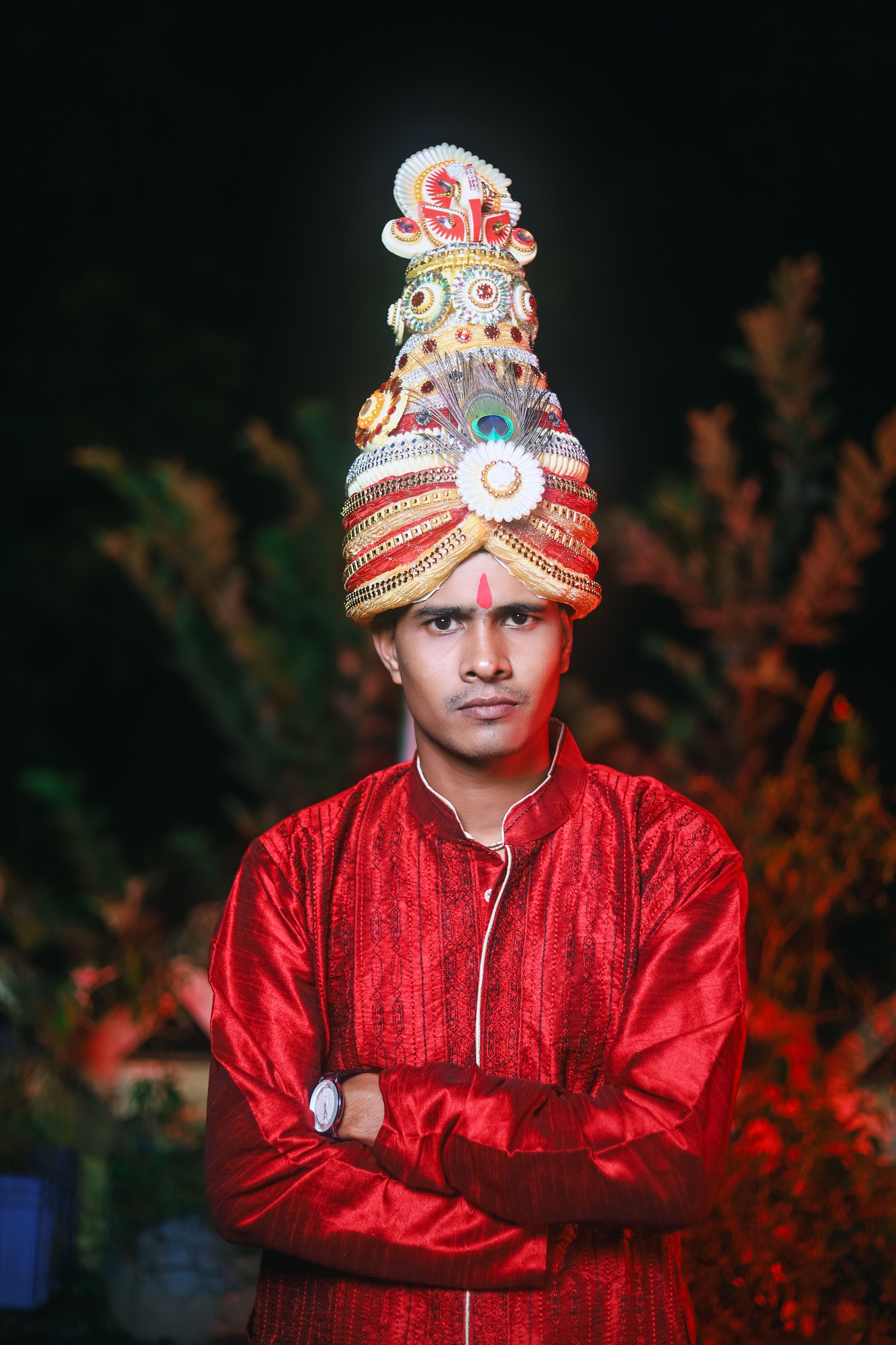 A man in traditional attire with a large headdress · Free Stock Photo