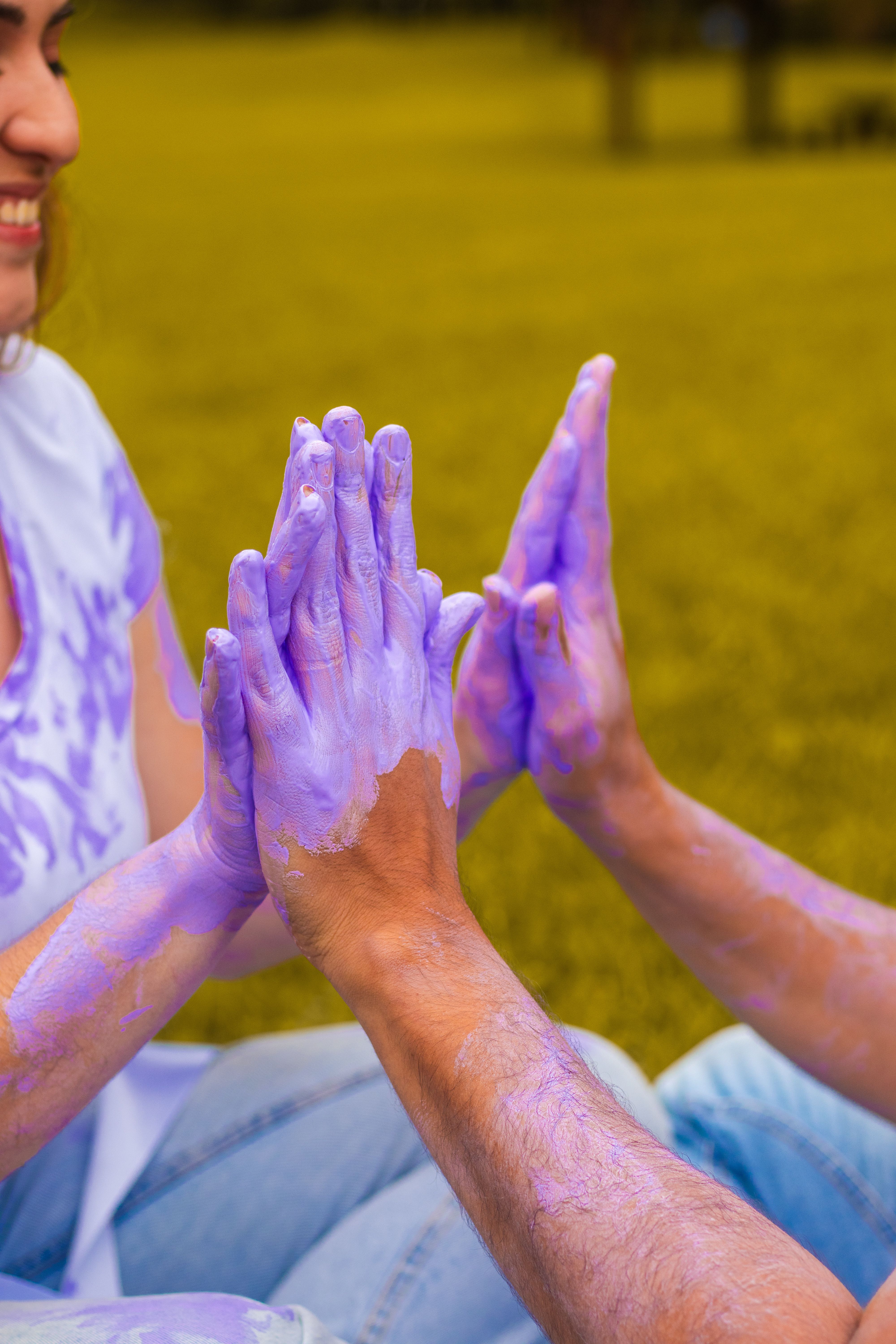 Couple with Purple Paint on Hands · Free Stock Photo