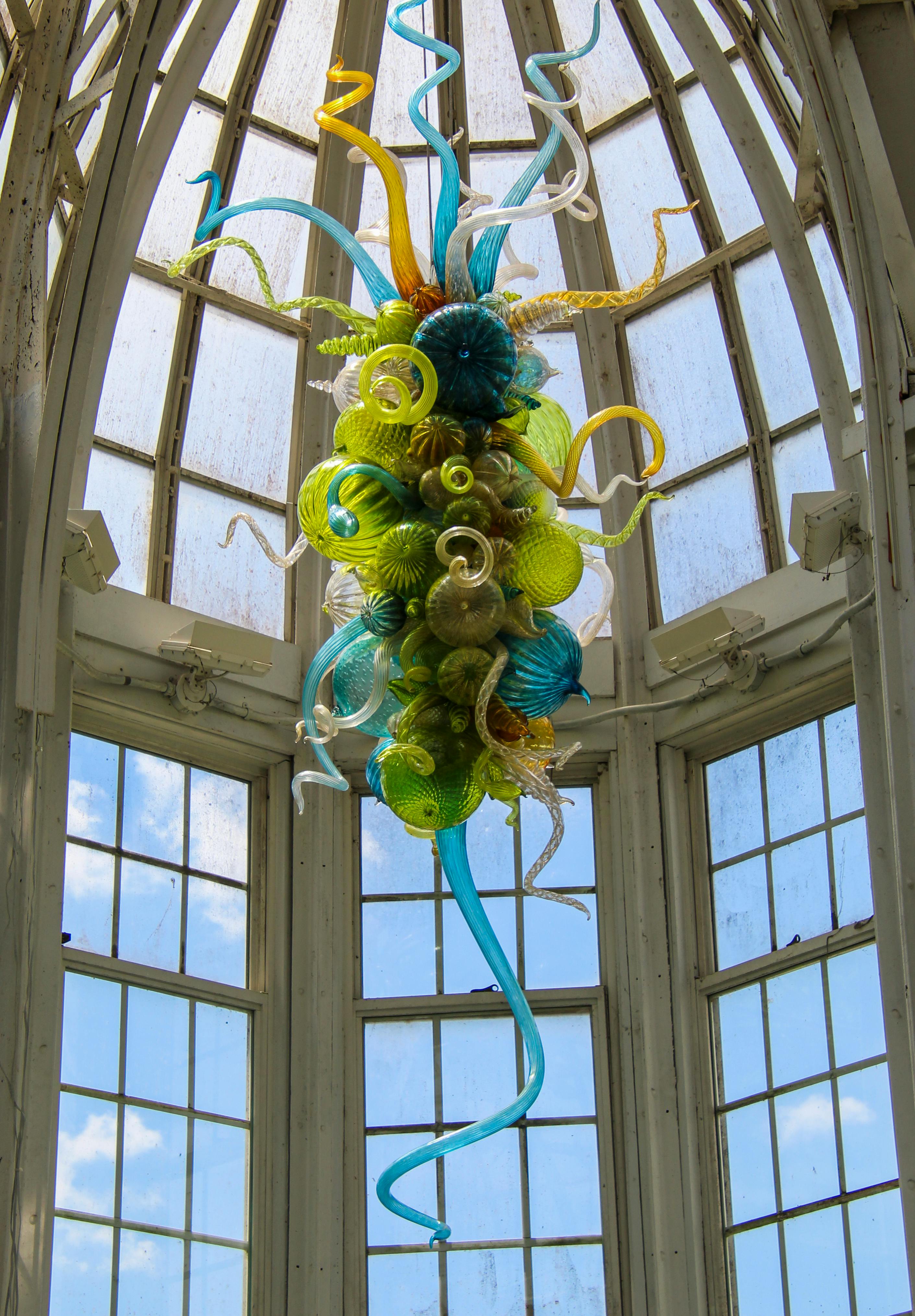 A large glass sculpture hanging from the ceiling · Free Stock Photo