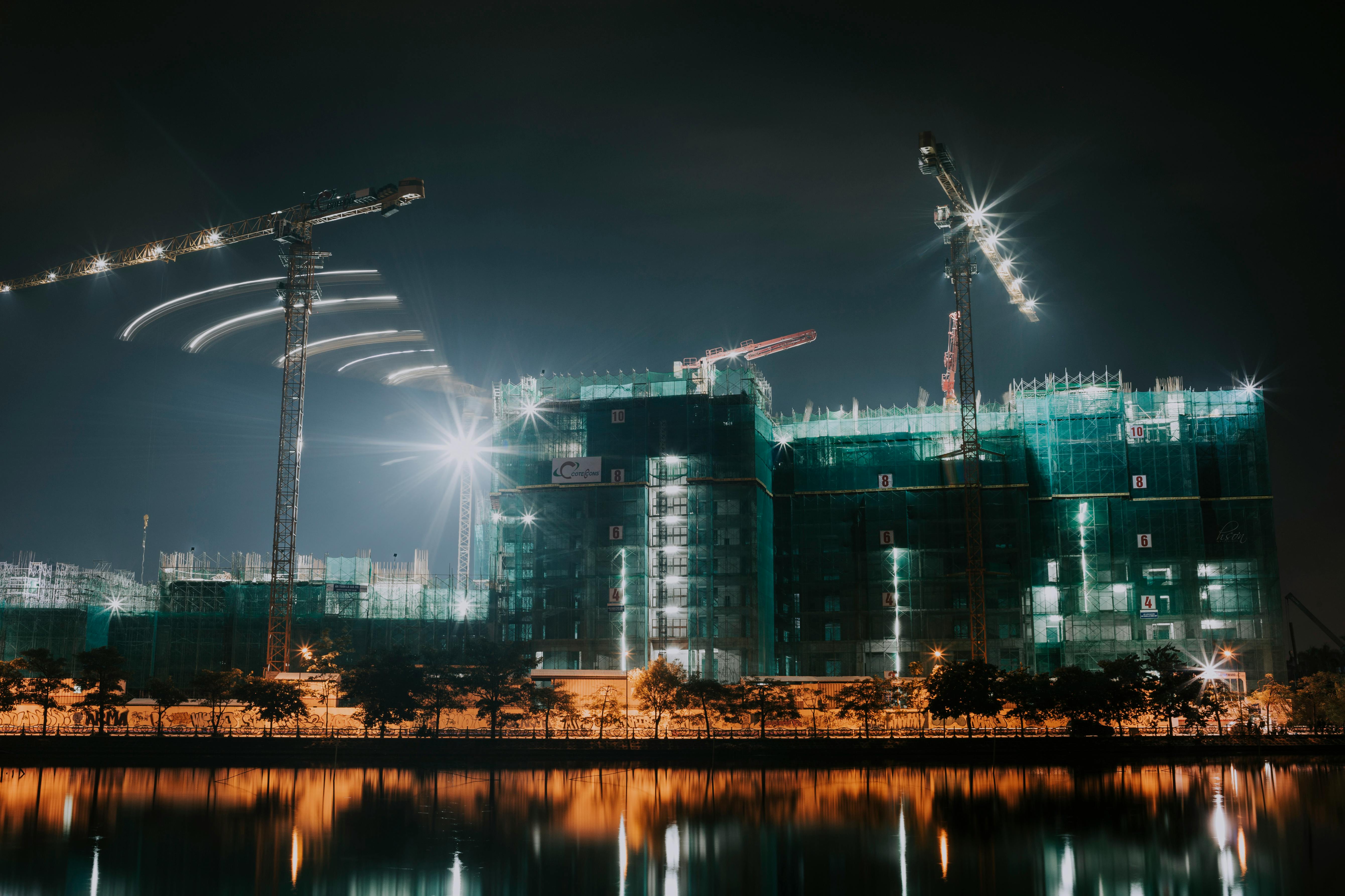 Construction Cranes at Construction Site at Night · Free Stock Photo