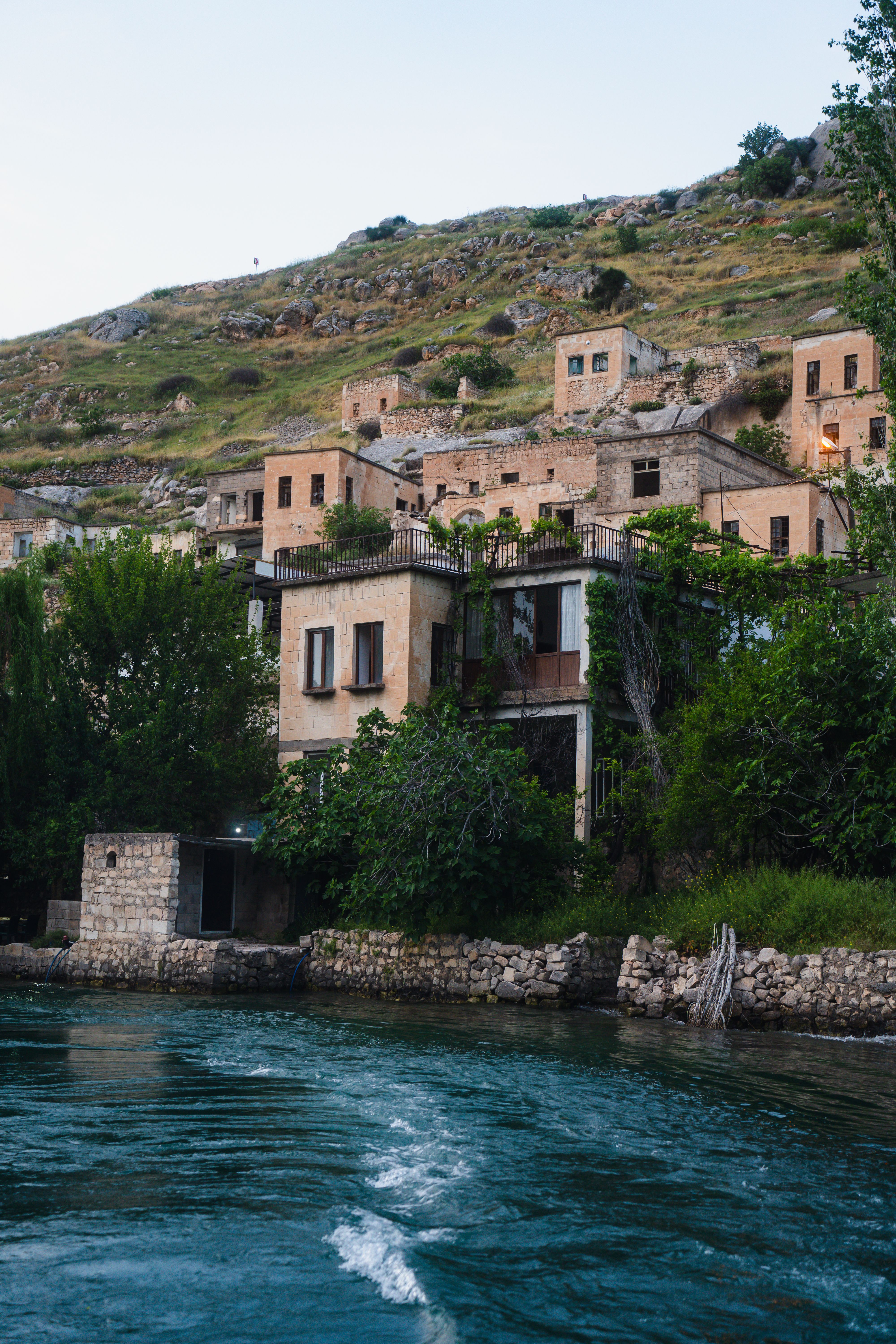 River and Houses under Hill in Countryside · Free Stock Photo