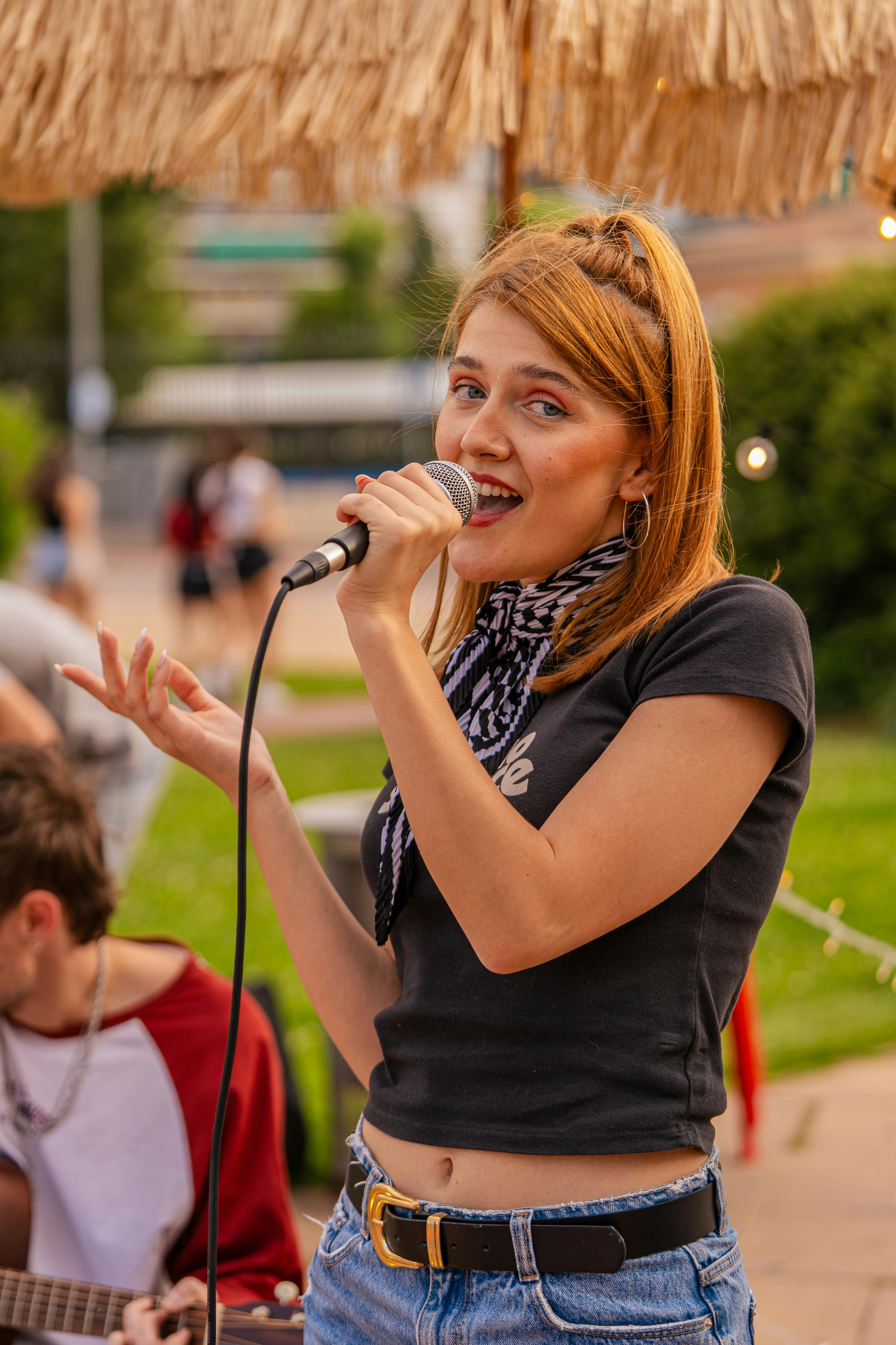 Singer Performing on the Sidewalk · Free Stock Photo