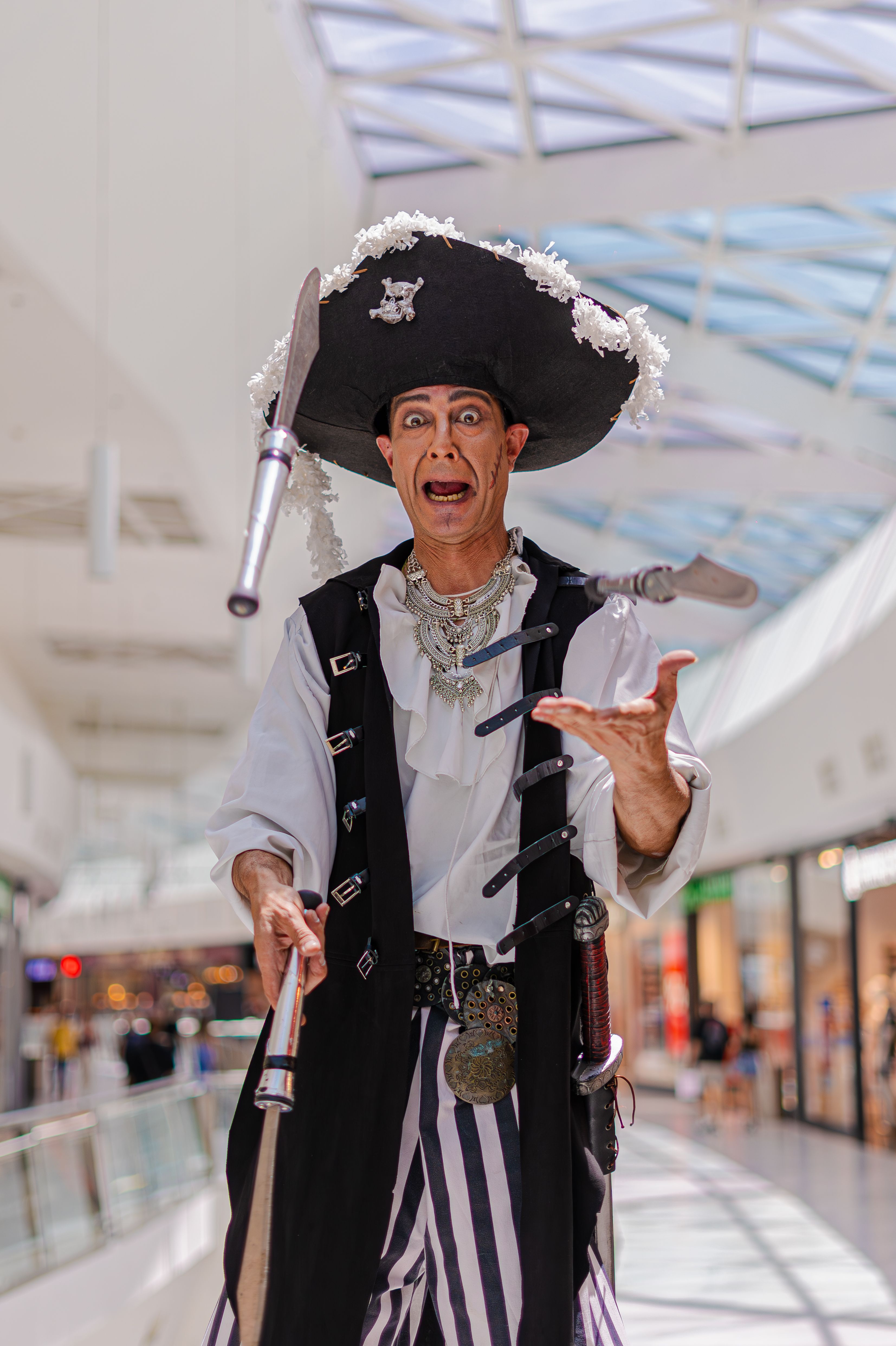 Scared Man in Pirate Costume Juggling Swords in Shopping Mall · Free ...