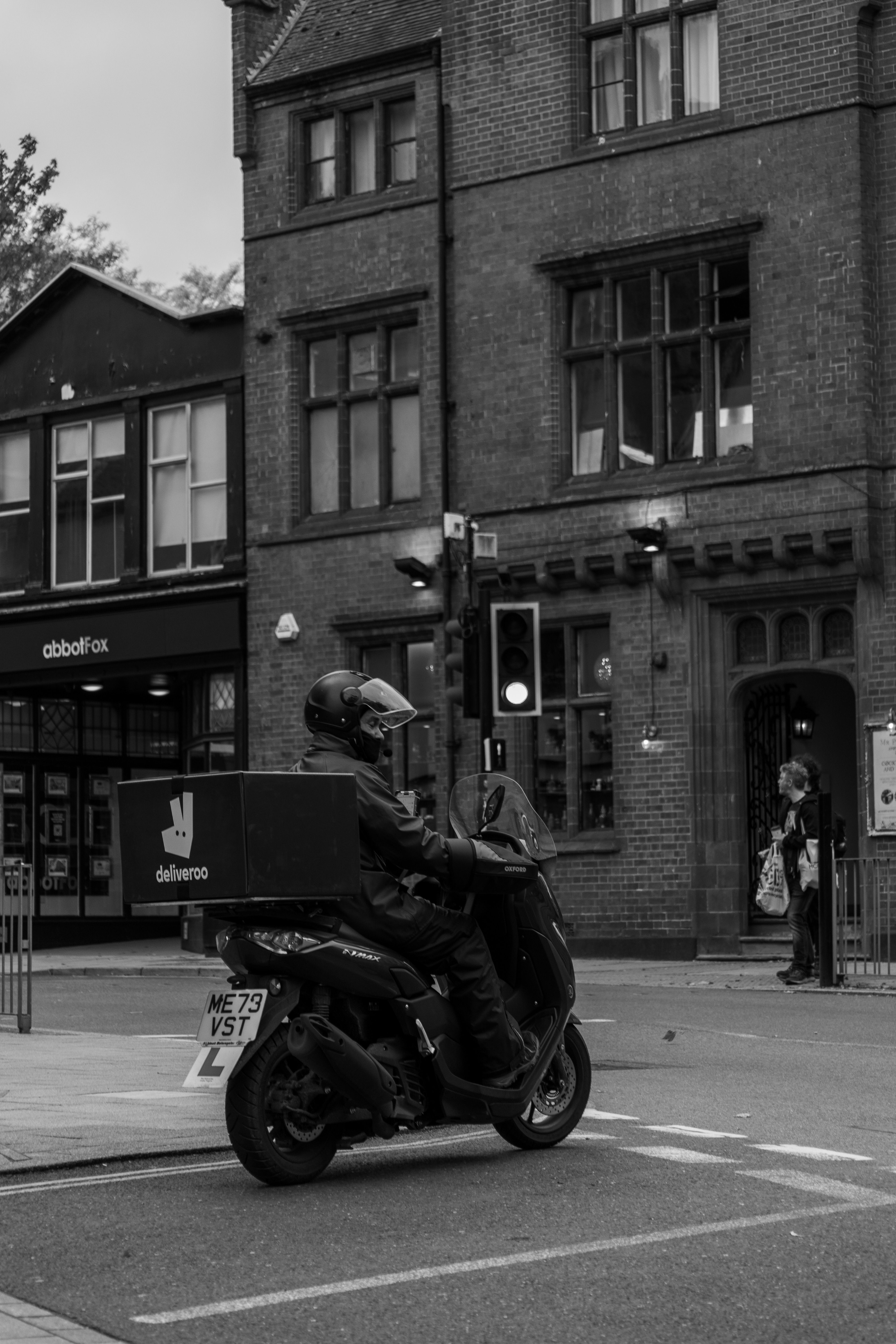 Delivery Driver Riding a Motor Scooter · Free Stock Photo
